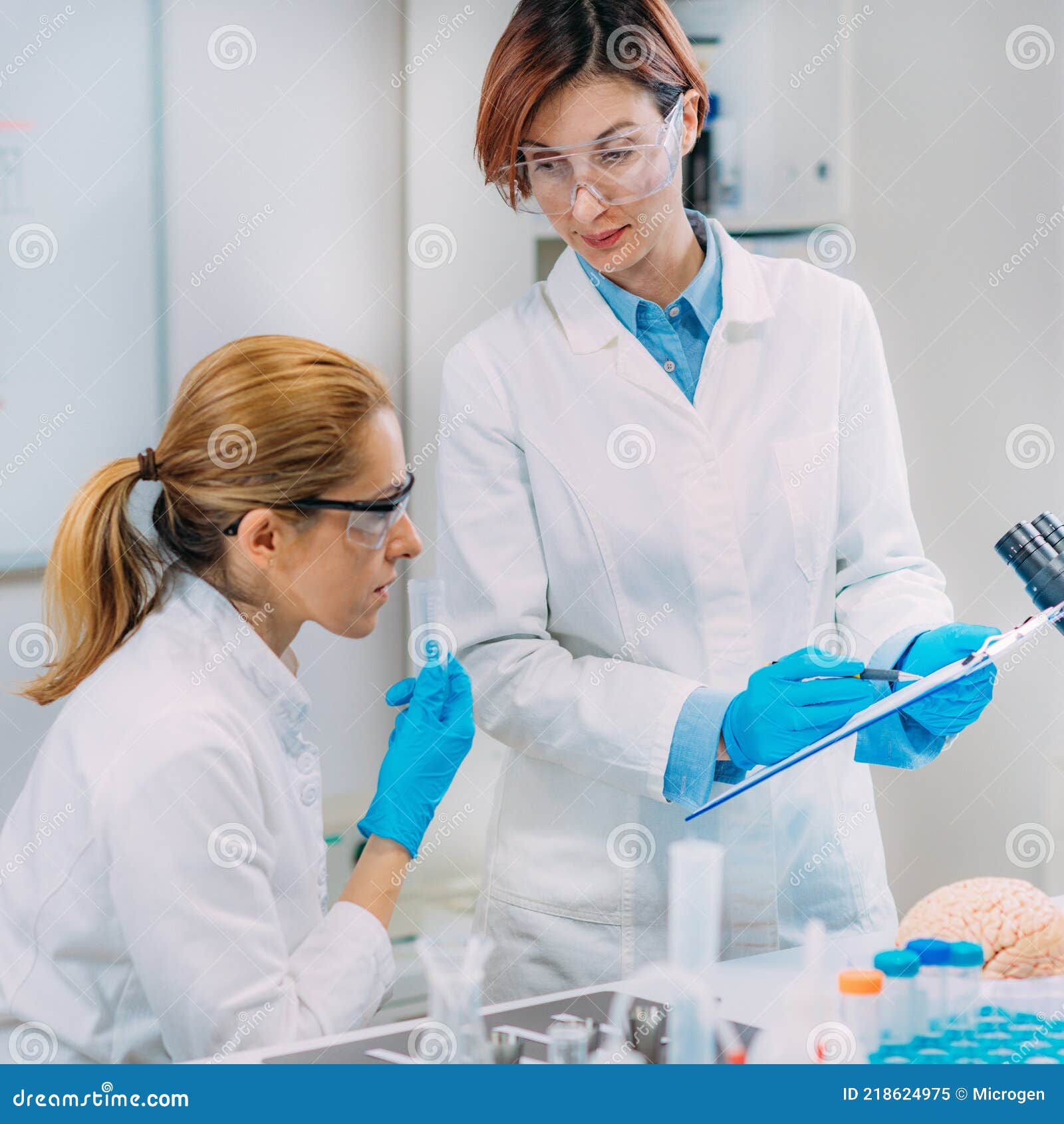 Olfactory Test in the Lab. Female Scientists Smelling a Sample in the ...