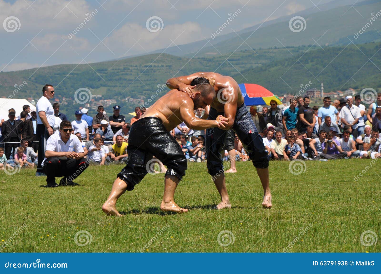 Olie het worstelen redactionele stock foto. Image of horloge - 63791938
