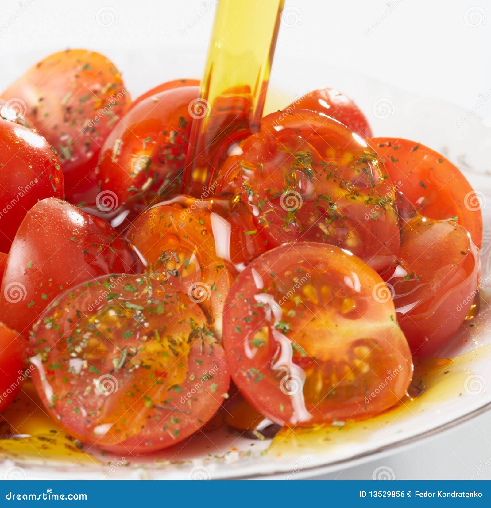 Olive Oil Being Poured on Spicy Tomatos Stock Photo - Image of dried ...