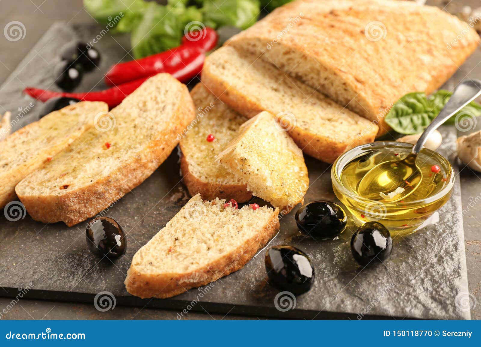 Olive Oil with Sliced Bread on Slate Plate Stock Photo - Image of black ...