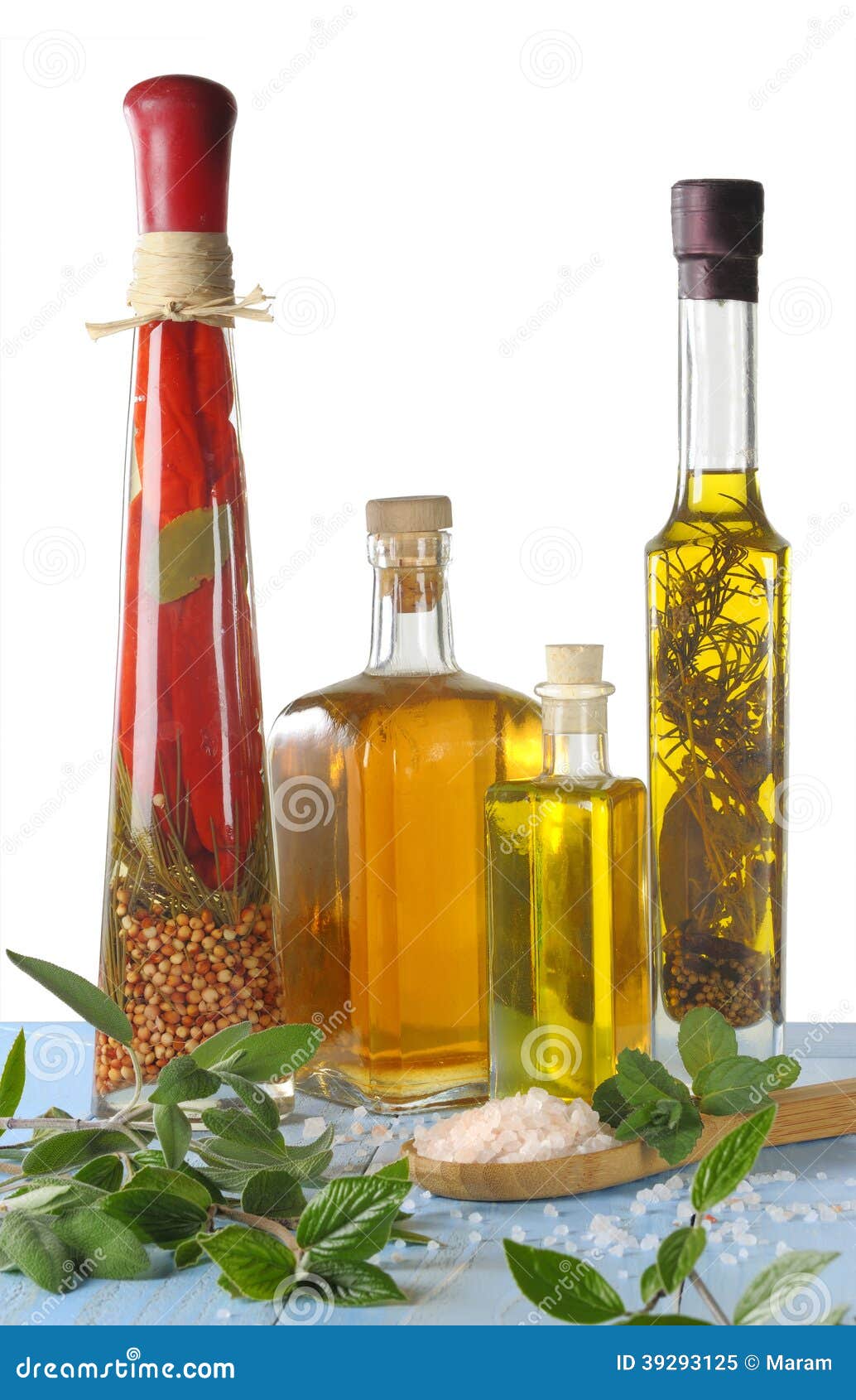 Olive Oils on a Blue Wooden Table with Herbs Stock Image - Image of ...