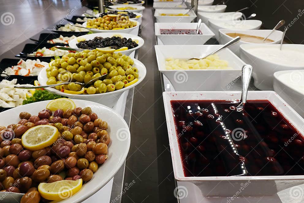 Olives and Sauces on the Buffet. Stock Photo - Image of container ...