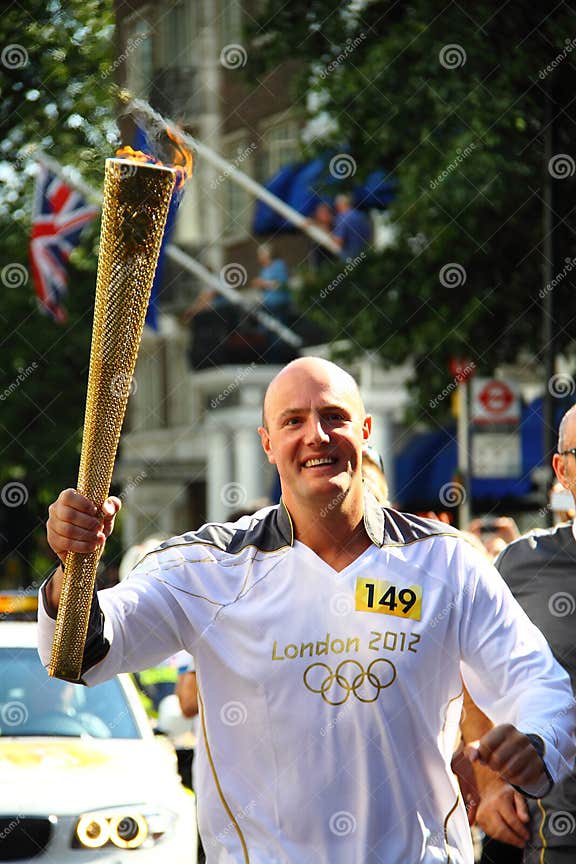 Olympic 2012 torch runner editorial stock photo. Image of event - 26054573
