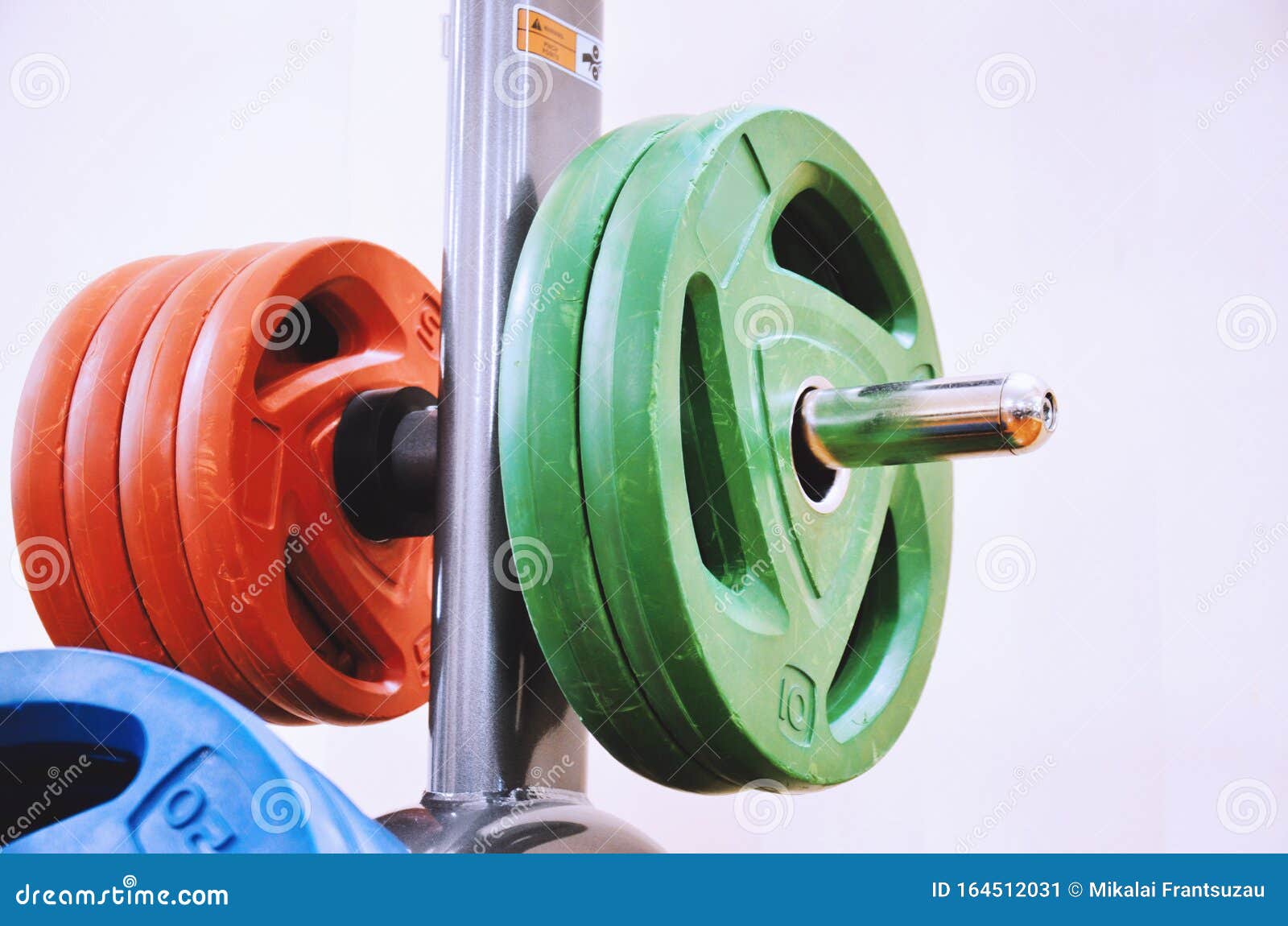 Olympic Training Rubberized Discs Of Different Weights In The Gym ...