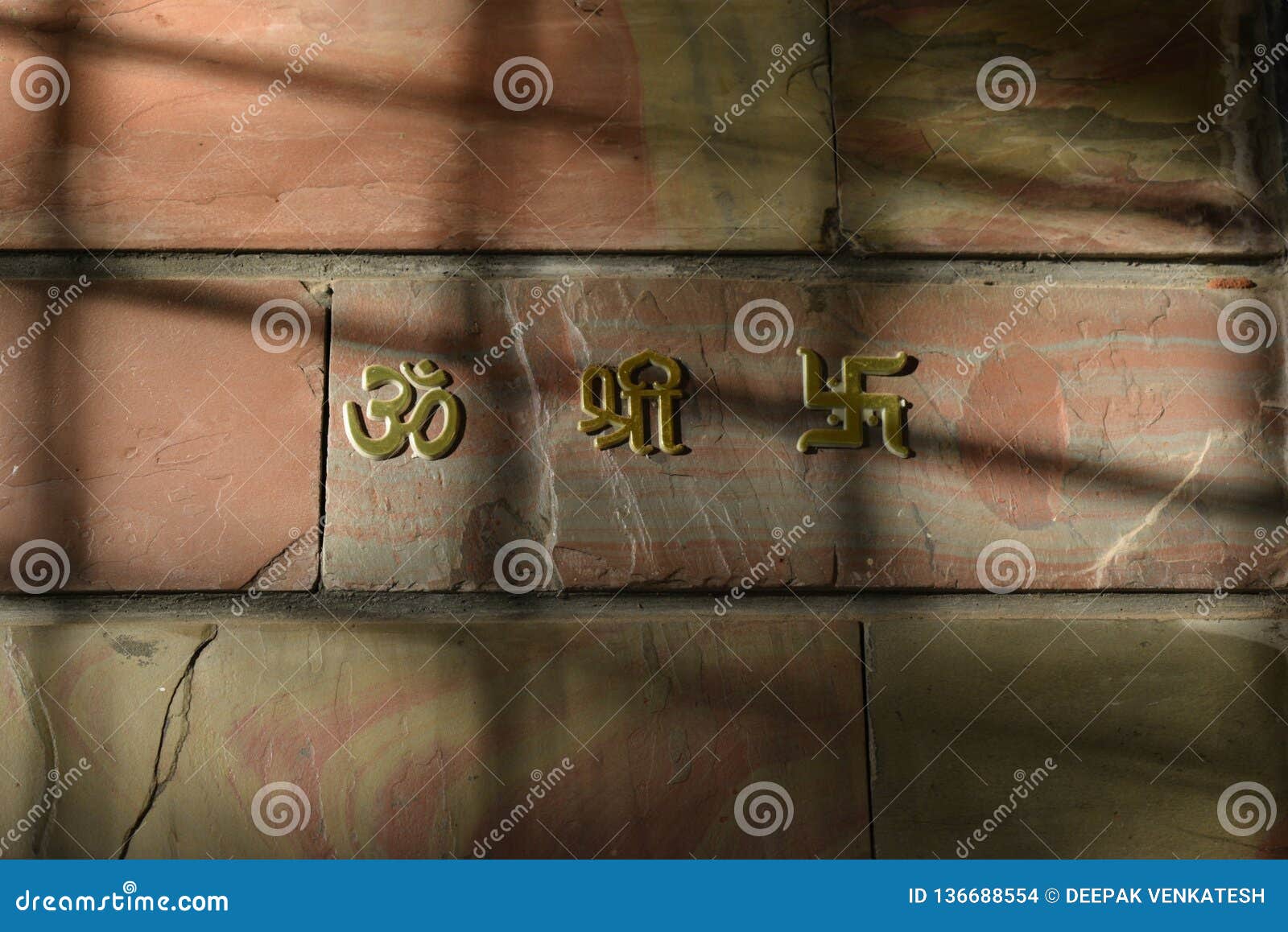 Om Shree Swastik Sticker on a Wall with Sun Light Stock Photo - Image ...