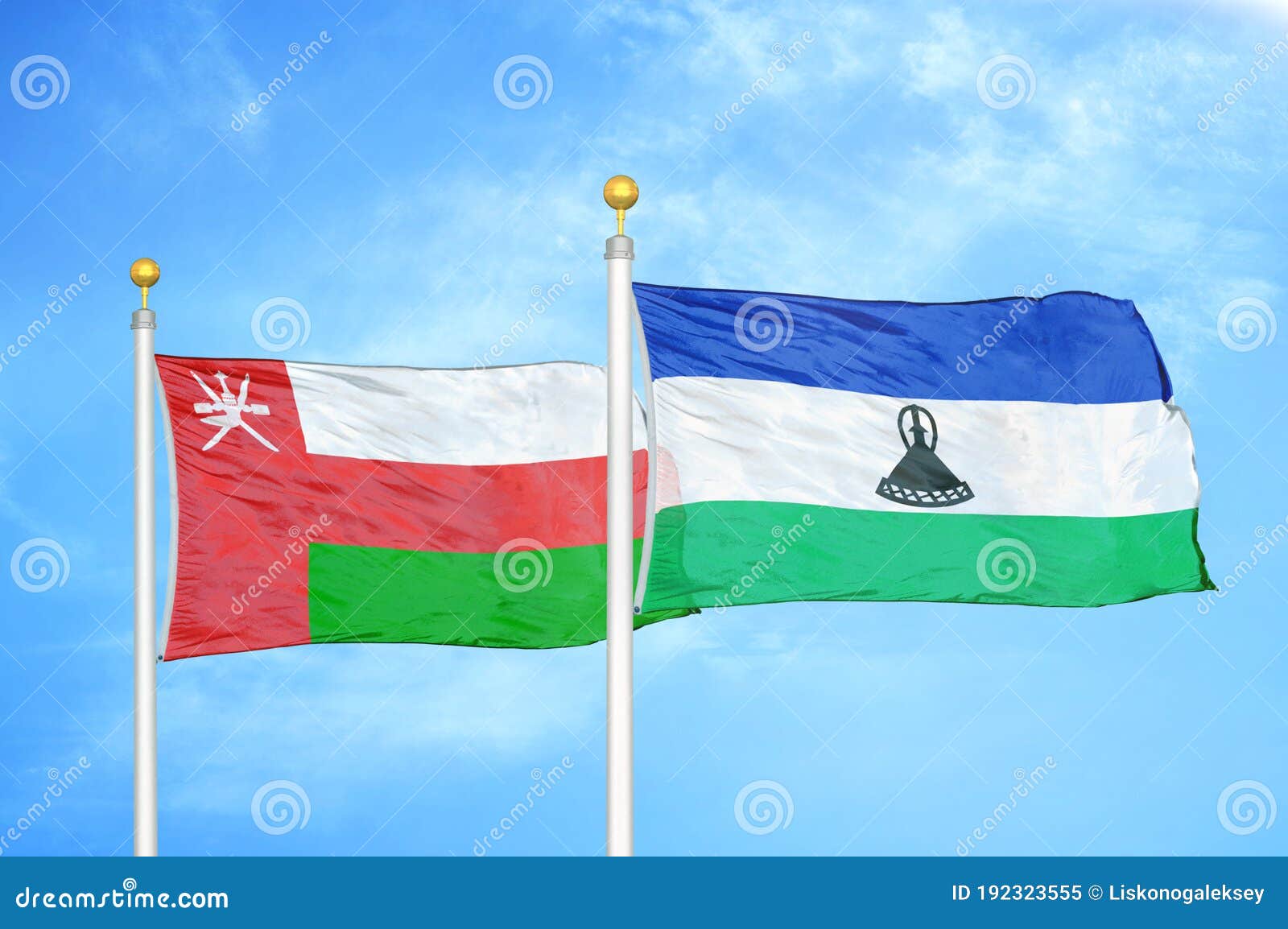 Oman and Lesotho Two Flags on Flagpoles and Blue Sky Stock Image ...