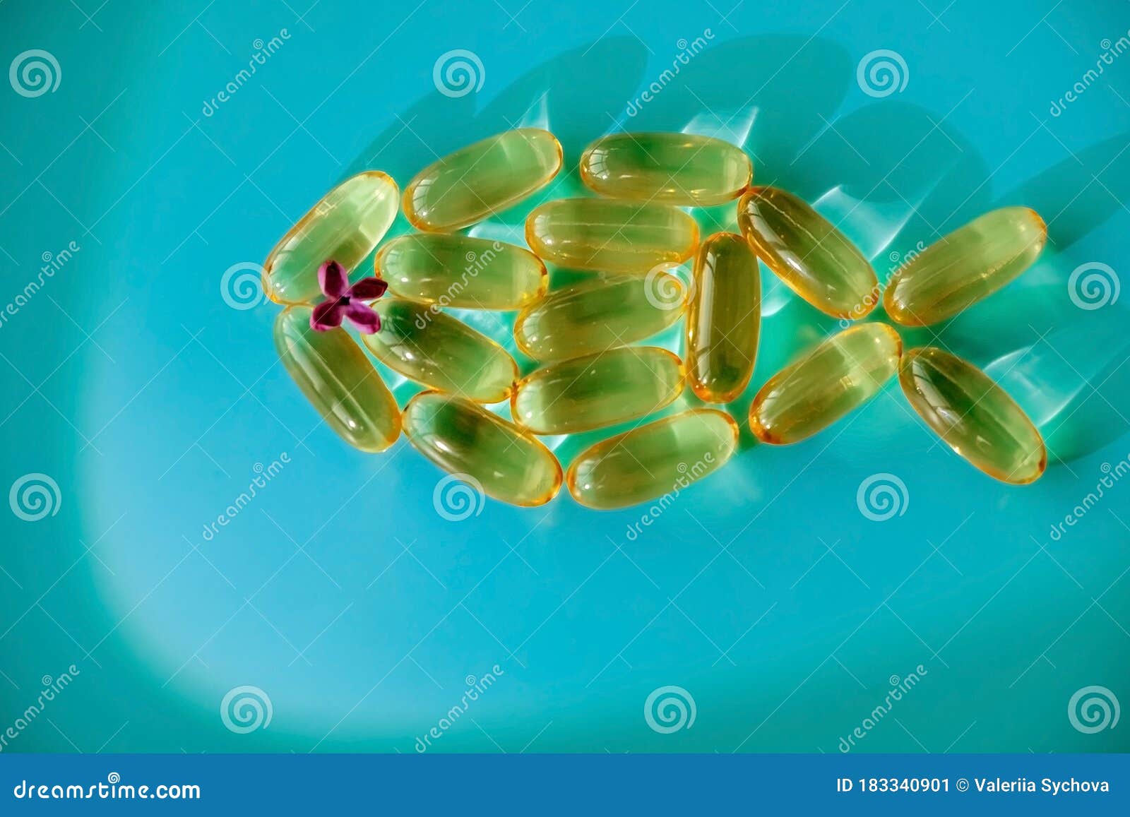 Omega 3 Capsules in the Form of Fish on a Blue Background . Stock Image ...