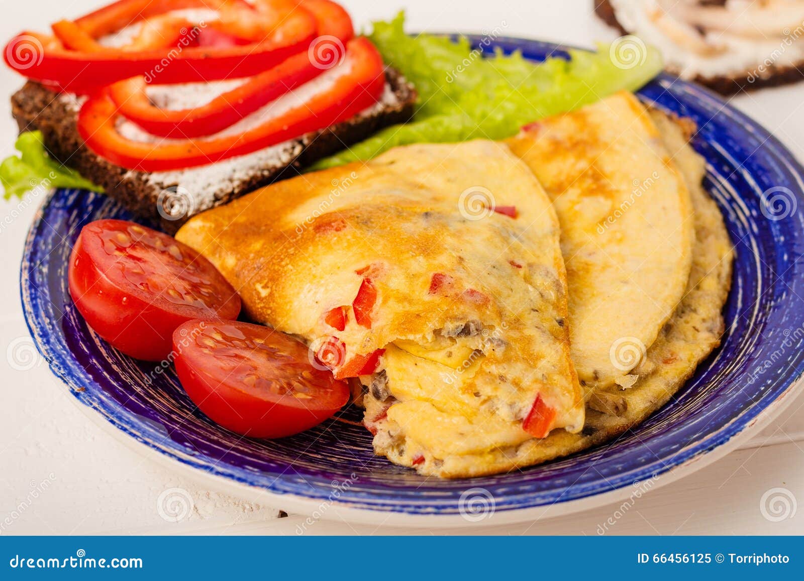 Omelet in a blue plate stock image. Image of morning - 66456125