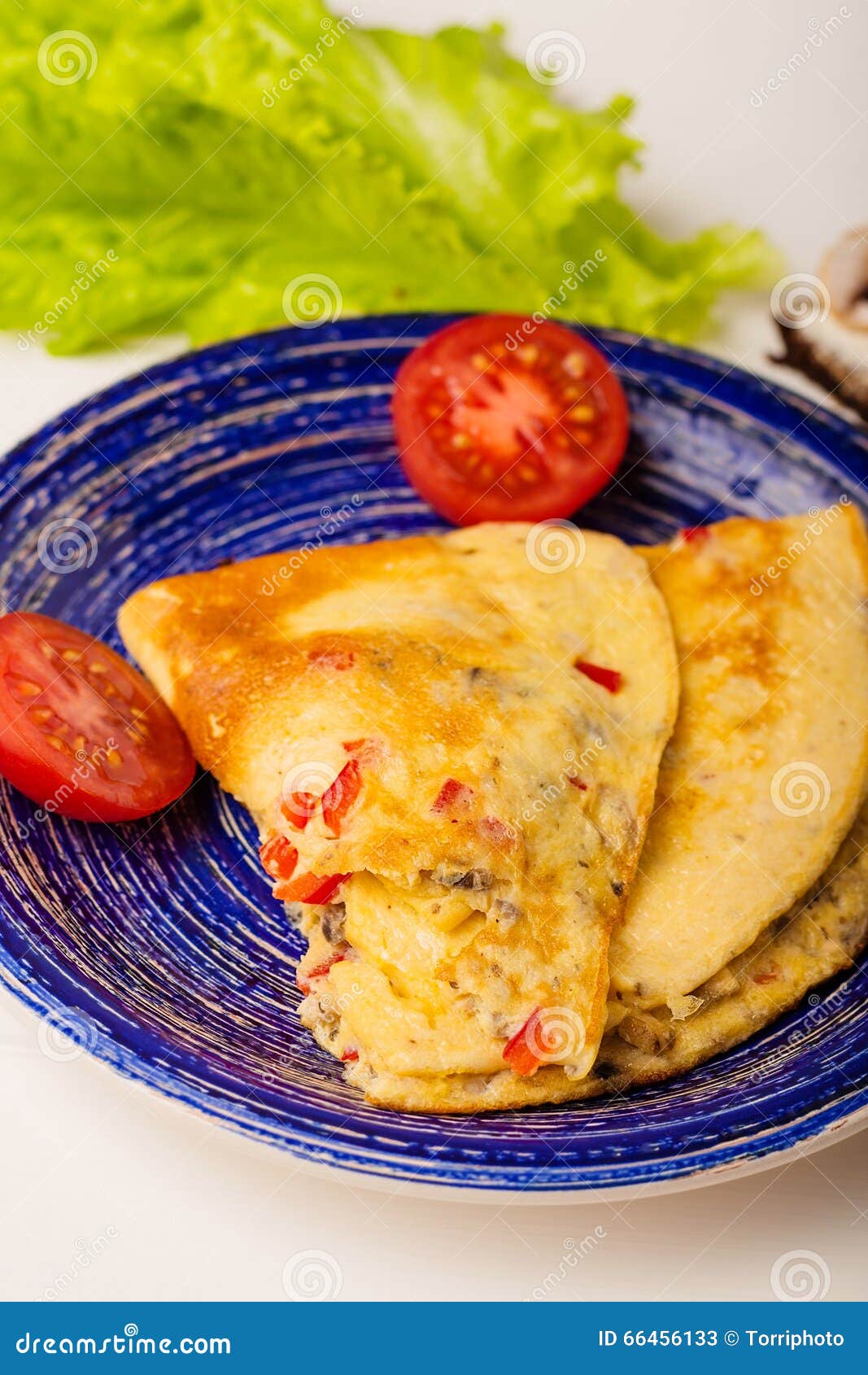 Omelet in a blue plate stock image. Image of homemade - 66456133