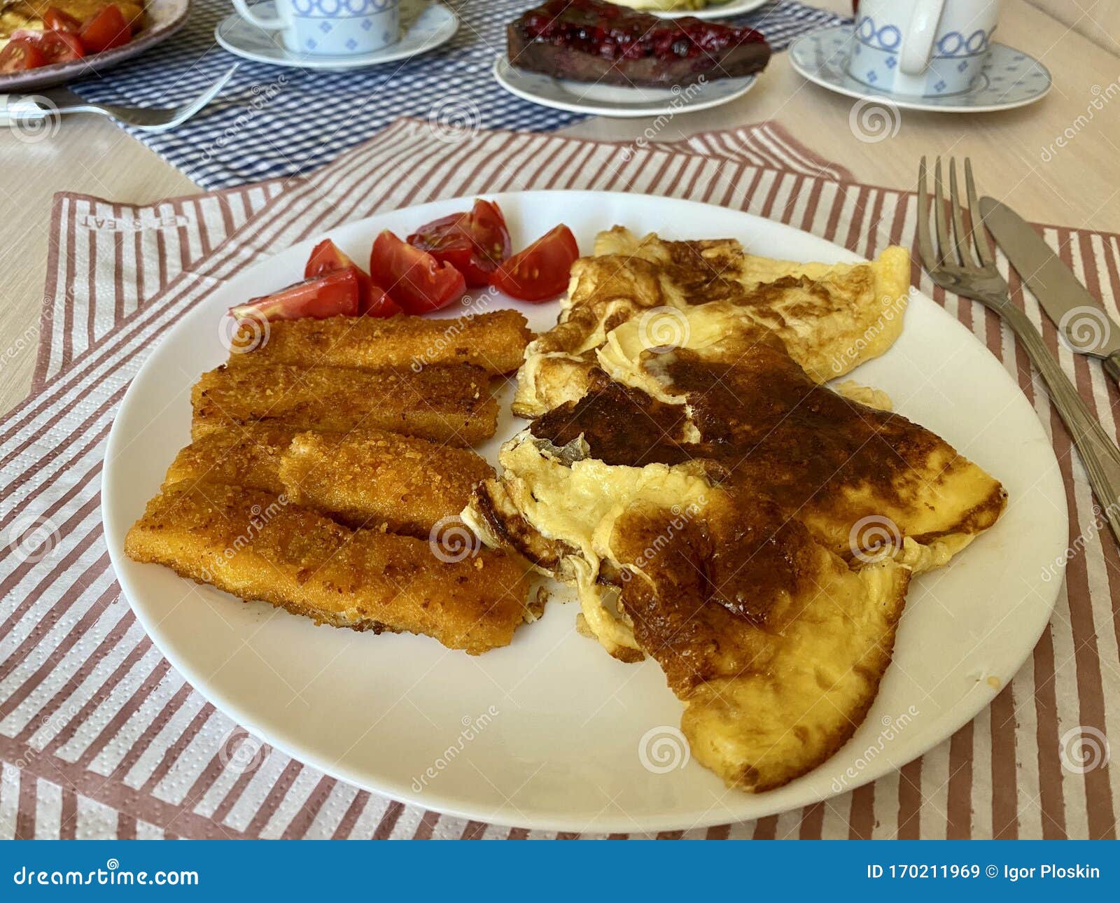 Omelette with breaded fish stock image. Image of fork - 170211969