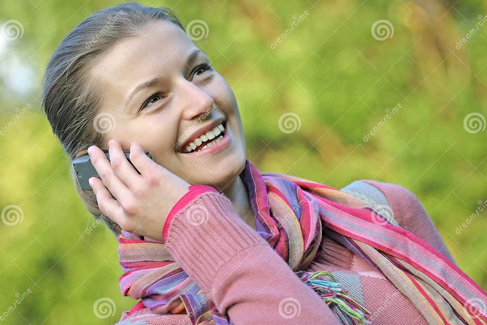 Ona a phone in the park stock image. Image of happy, calling - 453887