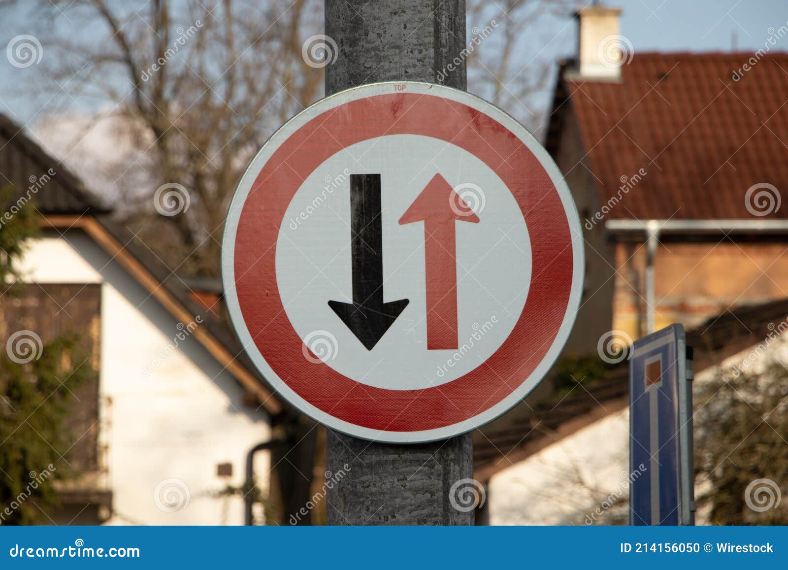 Oncoming Traffic Sign on a Post in the Street Stock Photo - Image of ...