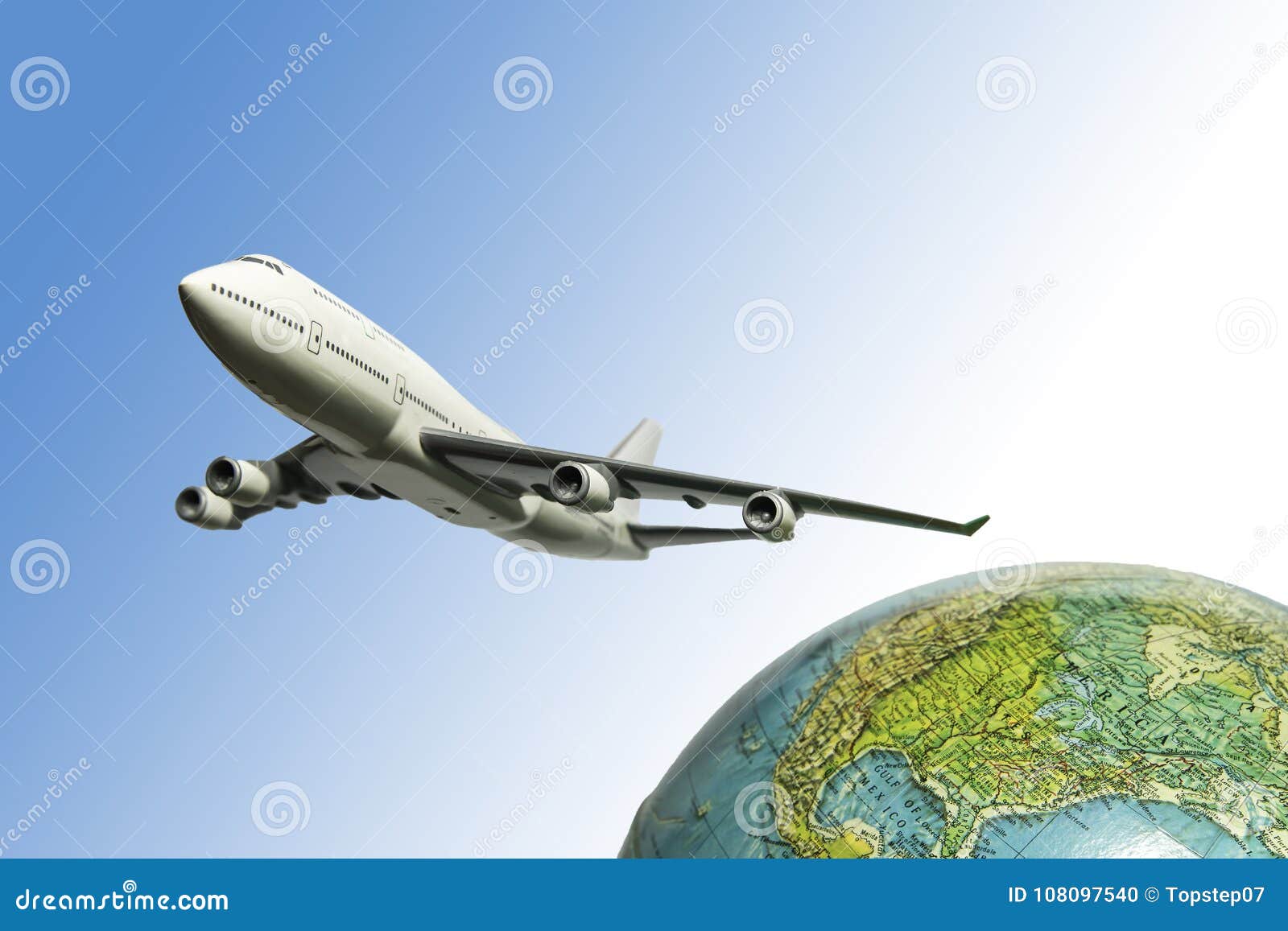 One Airplane Fly Over the Earth Isolated on Blue Background Stock Photo ...