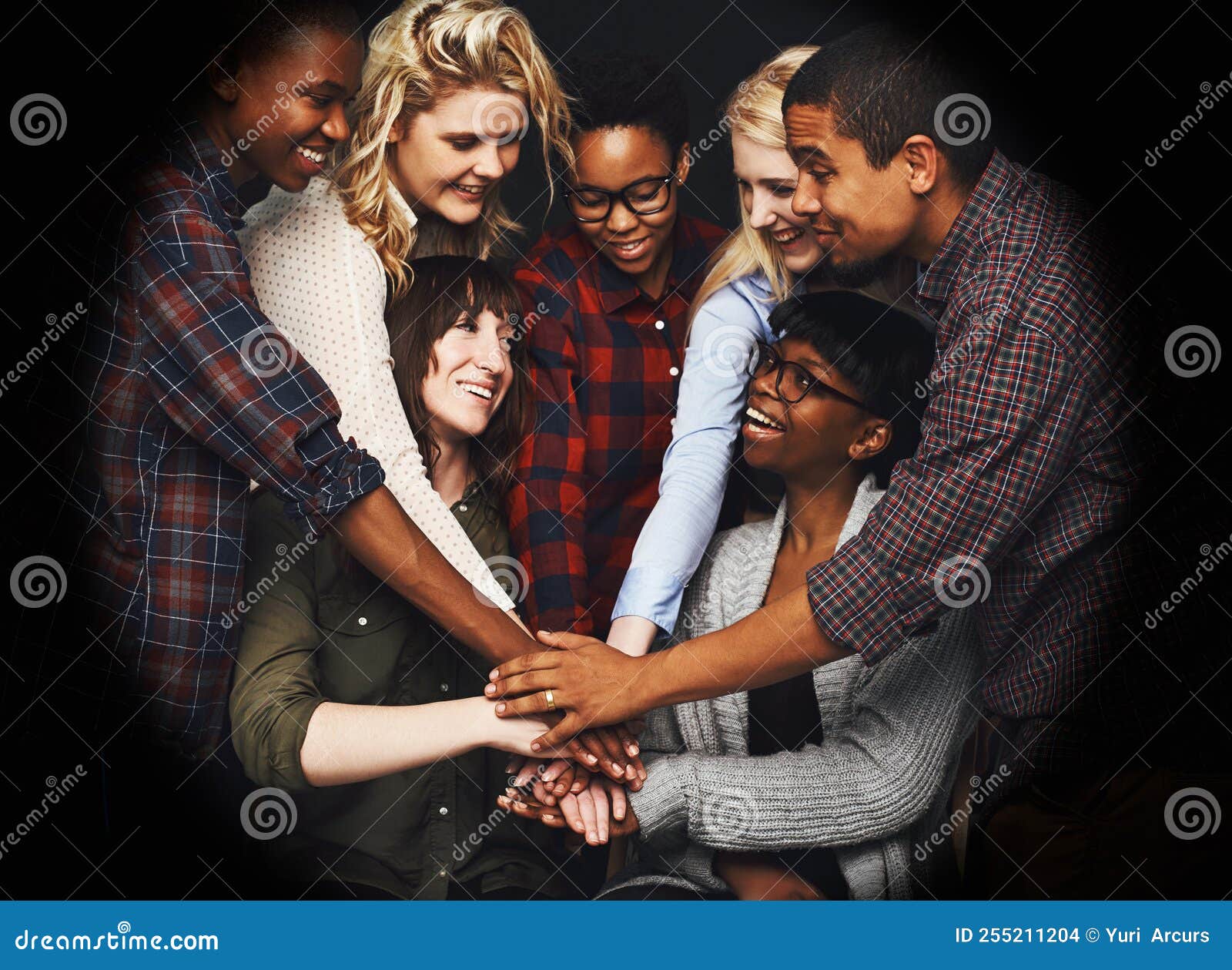 One for All. a Group of Cheerful Work Colleagues Forming a Huddle ...