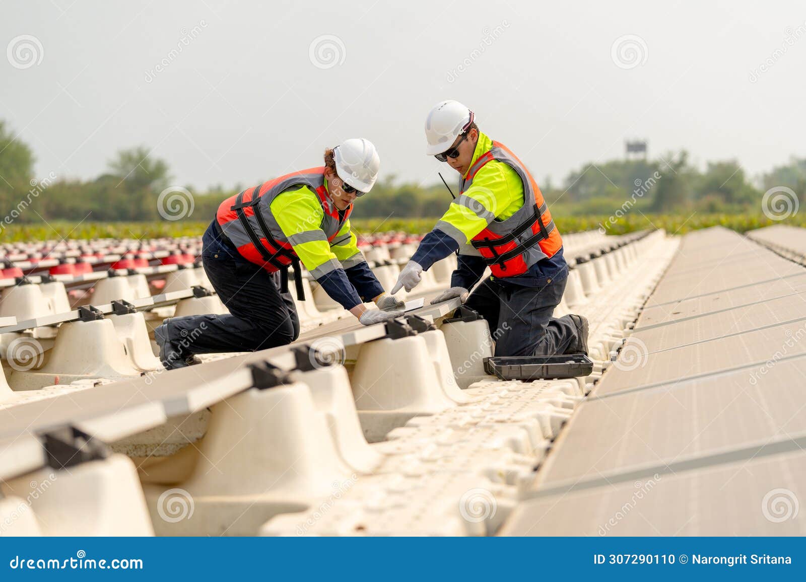 One Asian Technical Worker Sit and Touch Contact Area of Solar Cell ...