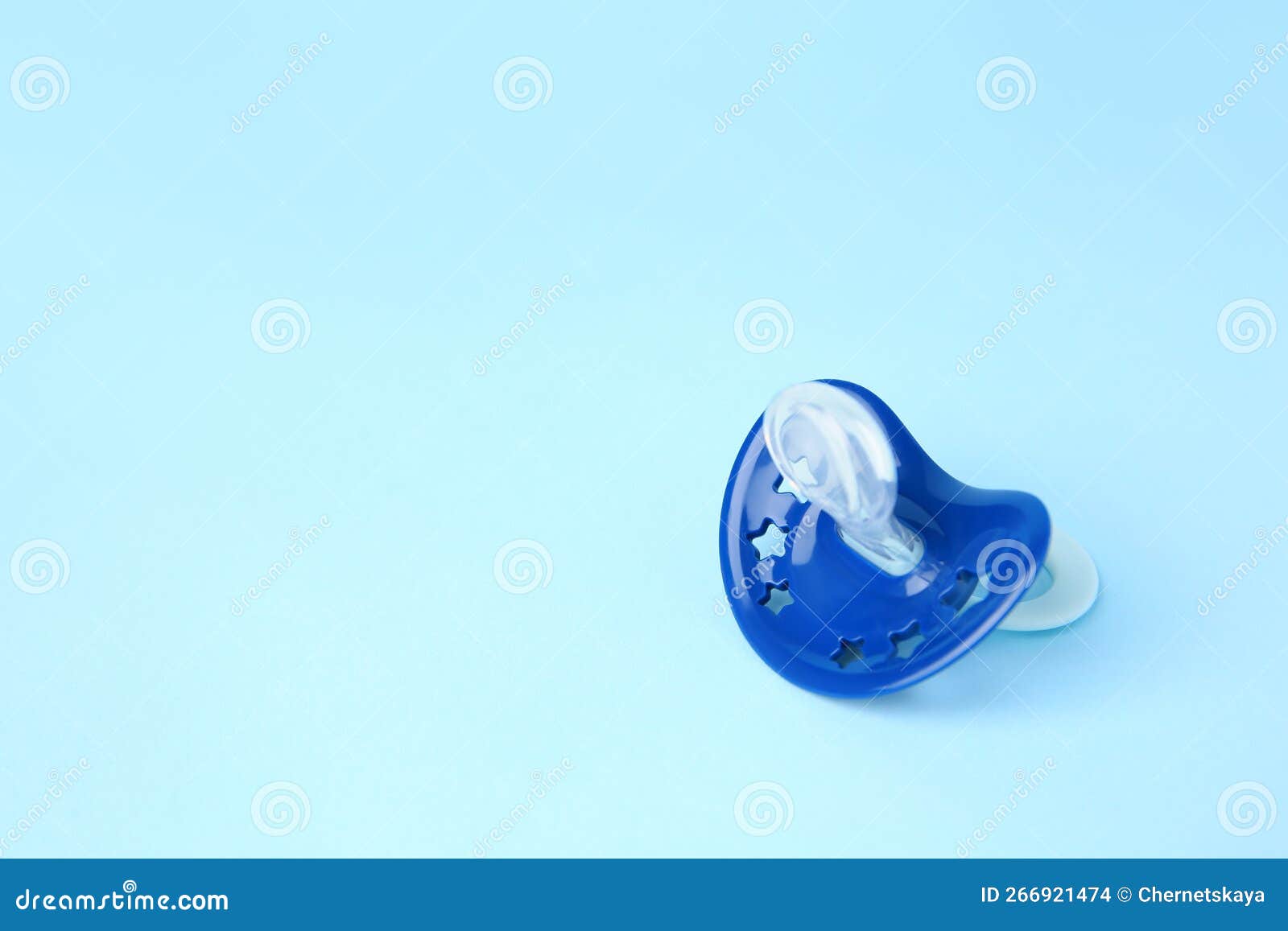 One Baby Pacifier on Light Blue Background. Space for Text Stock Photo ...