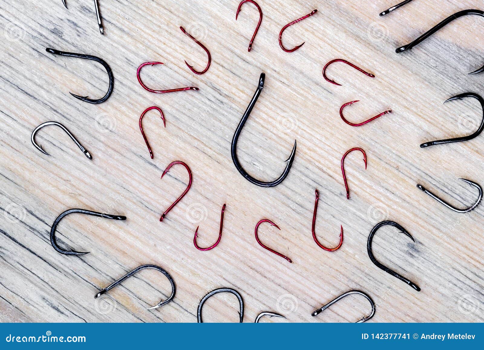 One Big Fishing Hook Surrounded by Other Fishing Hooks of Different ...