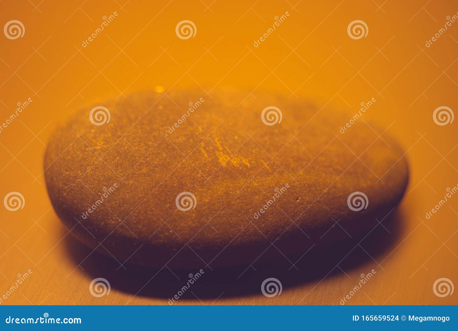 One Big Pebble Stone on the Table, Orange Light. Stock Photo - Image of ...