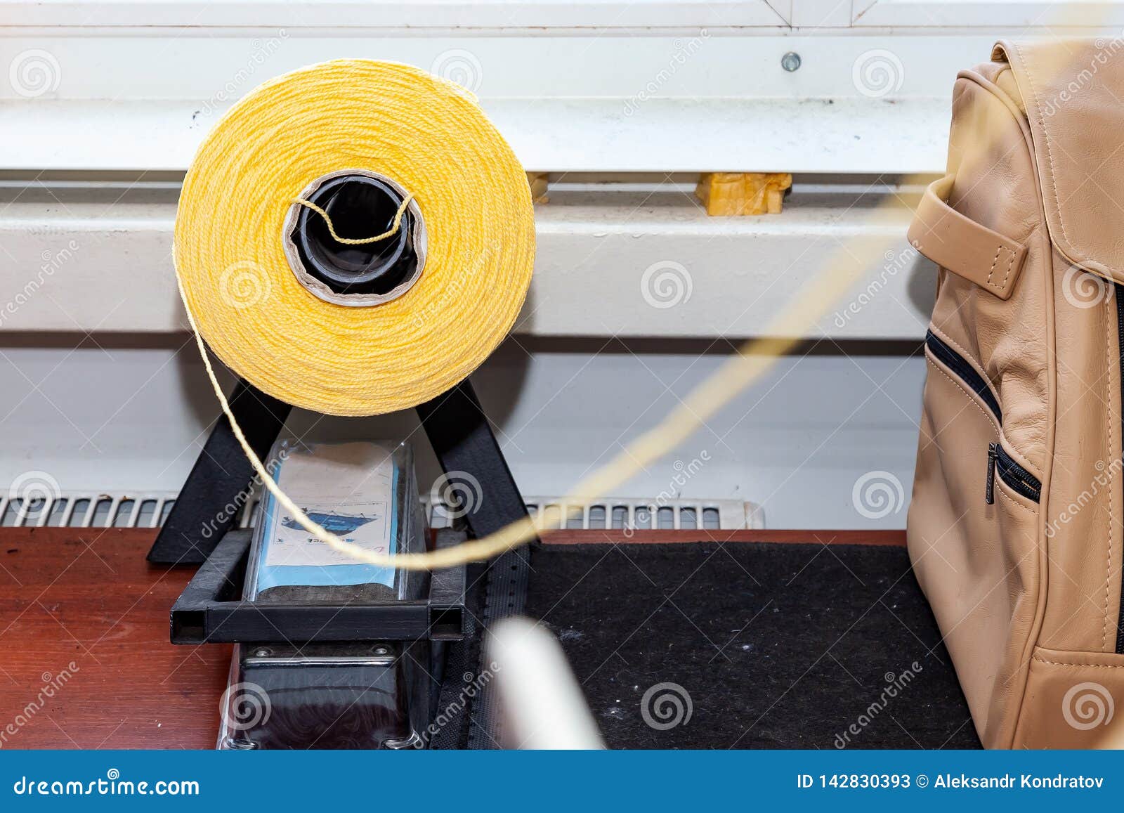 One Big Yellow Bobbin with Large Mating Colored Threads in the Studio ...