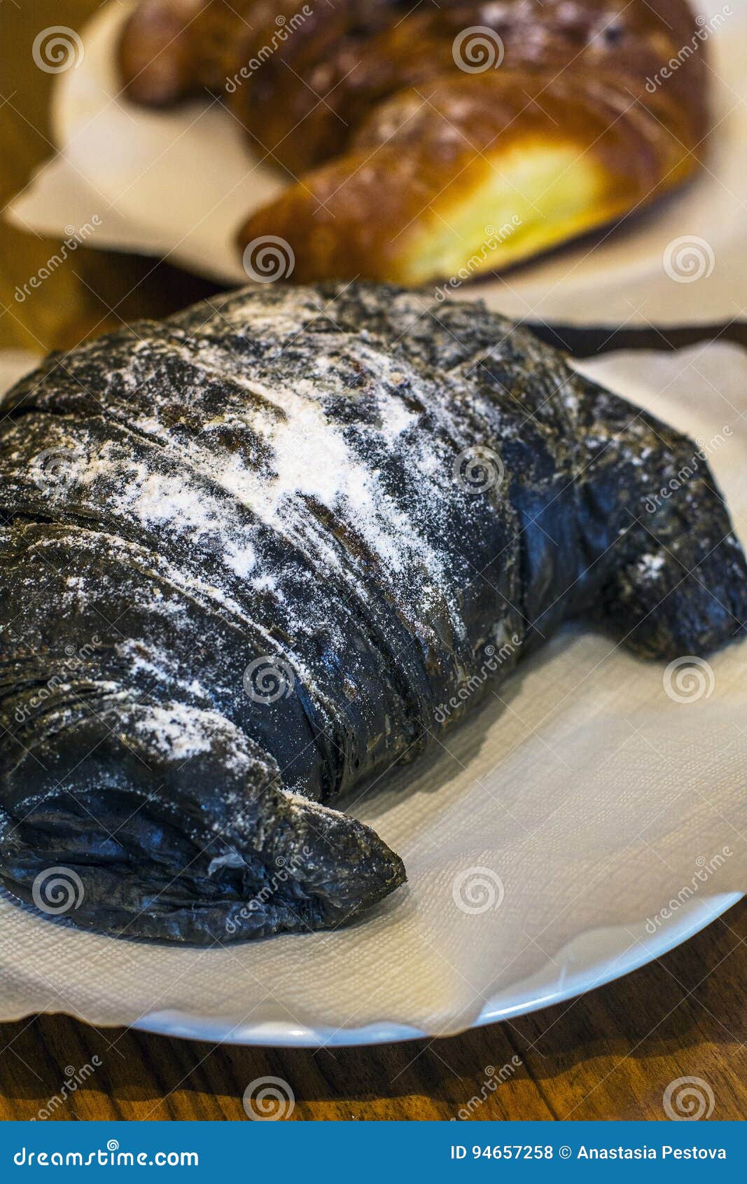 One black croissant stock photo. Image of vertical, pastry - 94657258
