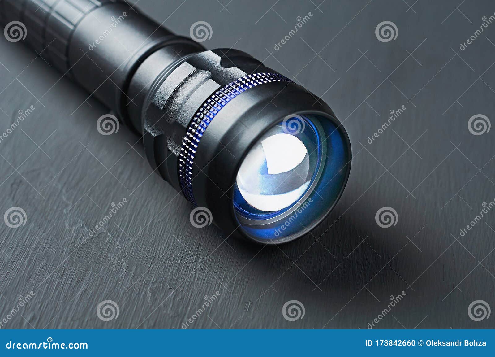 One Black Tactical Flashlight Lies on Dark Concrete Table Stock Photo ...