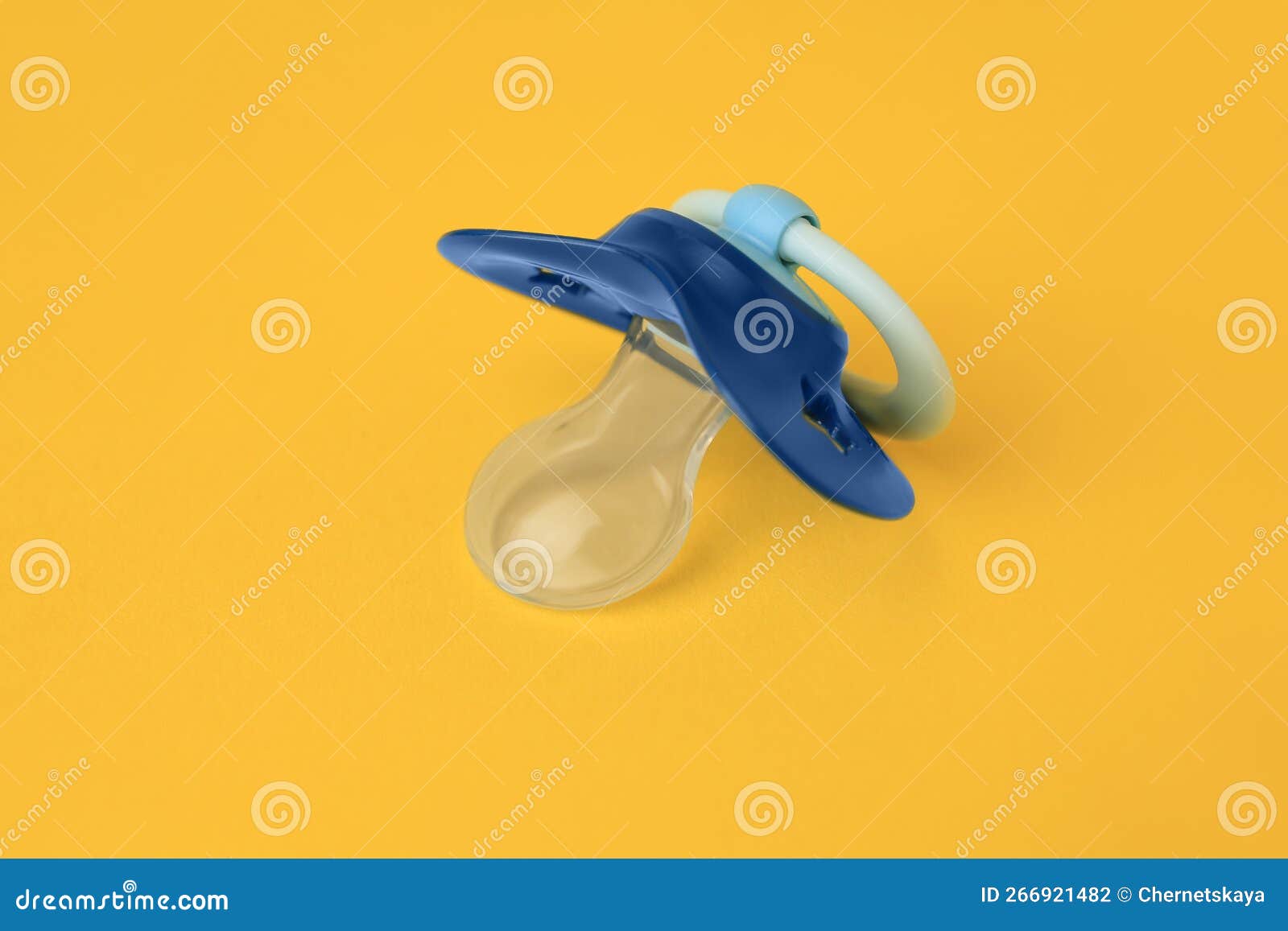 One Blue Baby Pacifier on Orange Background Stock Photo - Image of ...