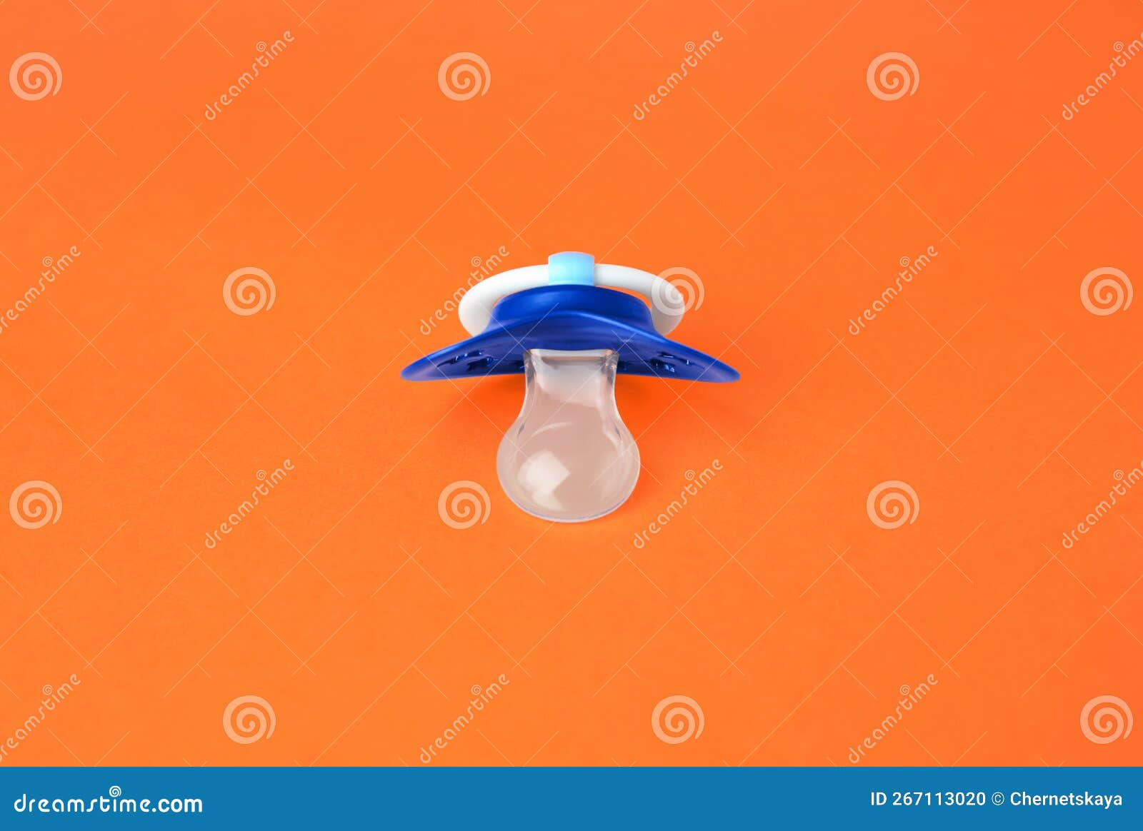 One Blue Baby Pacifier on Orange Background Stock Photo - Image of ...