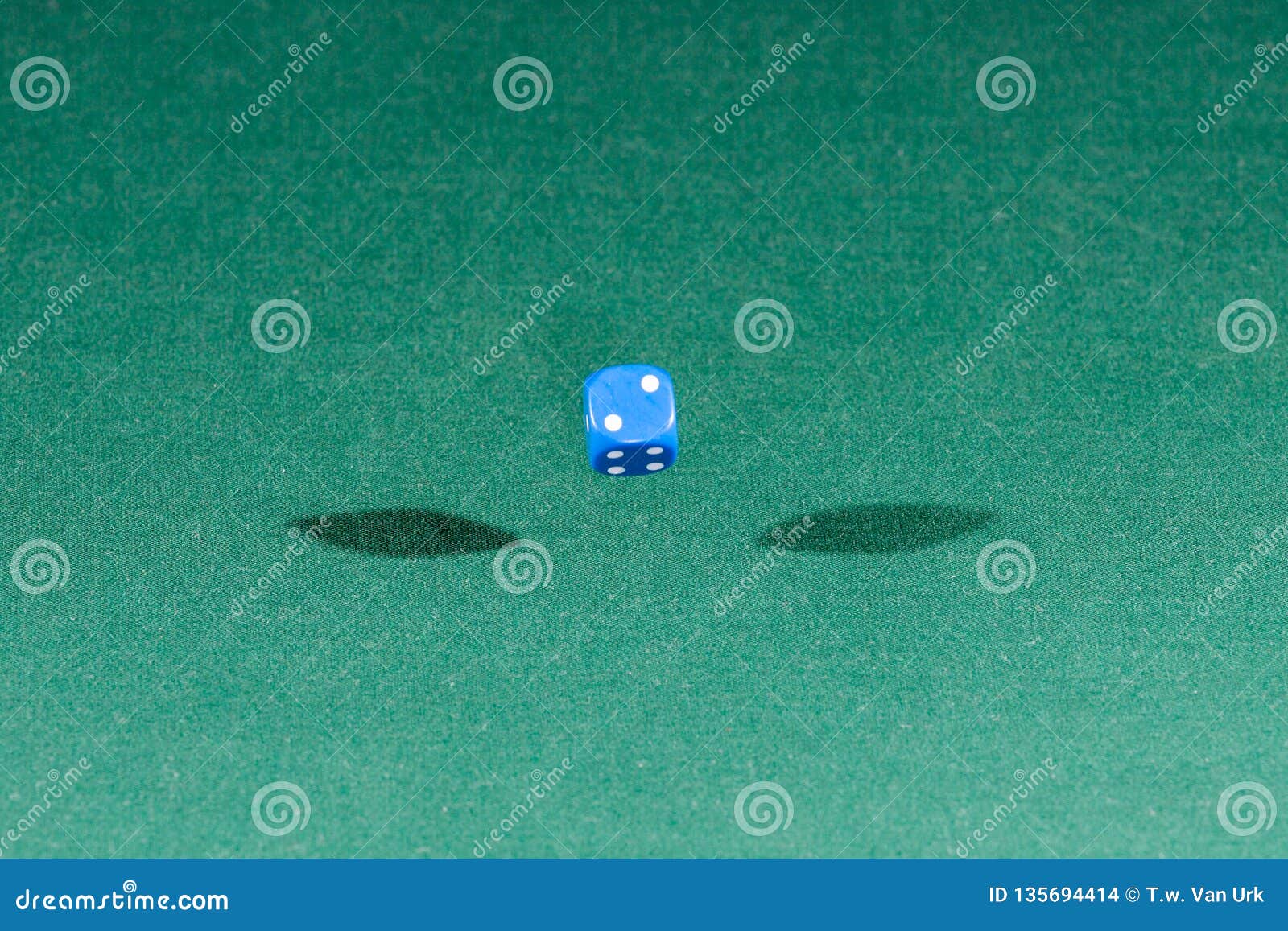 One Blue Dice Falling on a Green Table Stock Photo - Image of closeup ...
