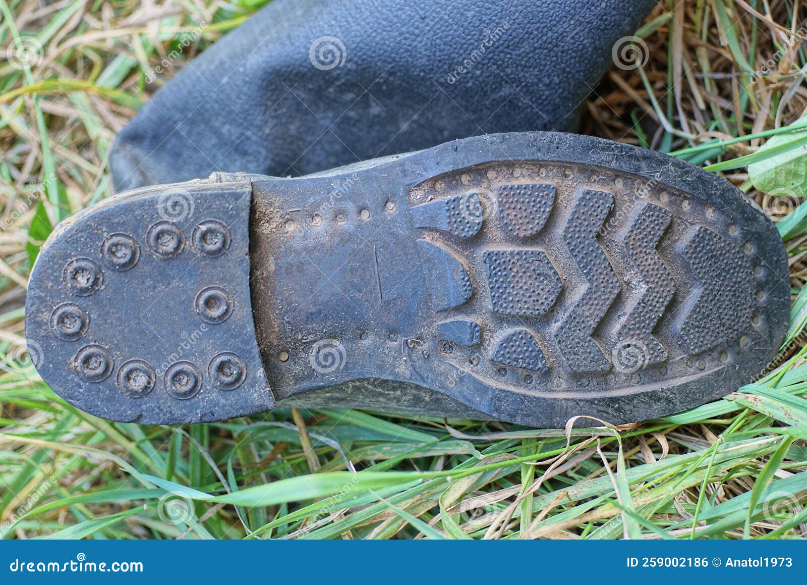 One Boot with a Rubber Dirty Old Sole with a Black Gray Pattern Stock ...