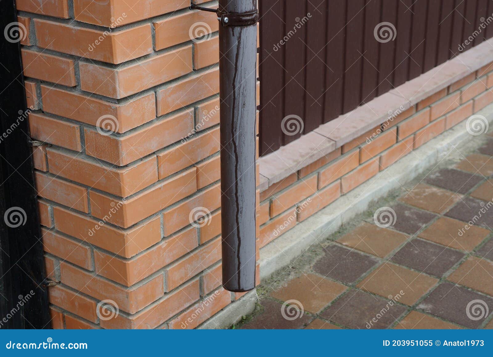 One Brown Plastic Gutter Pipe on a Brick Wall Stock Image - Image of ...