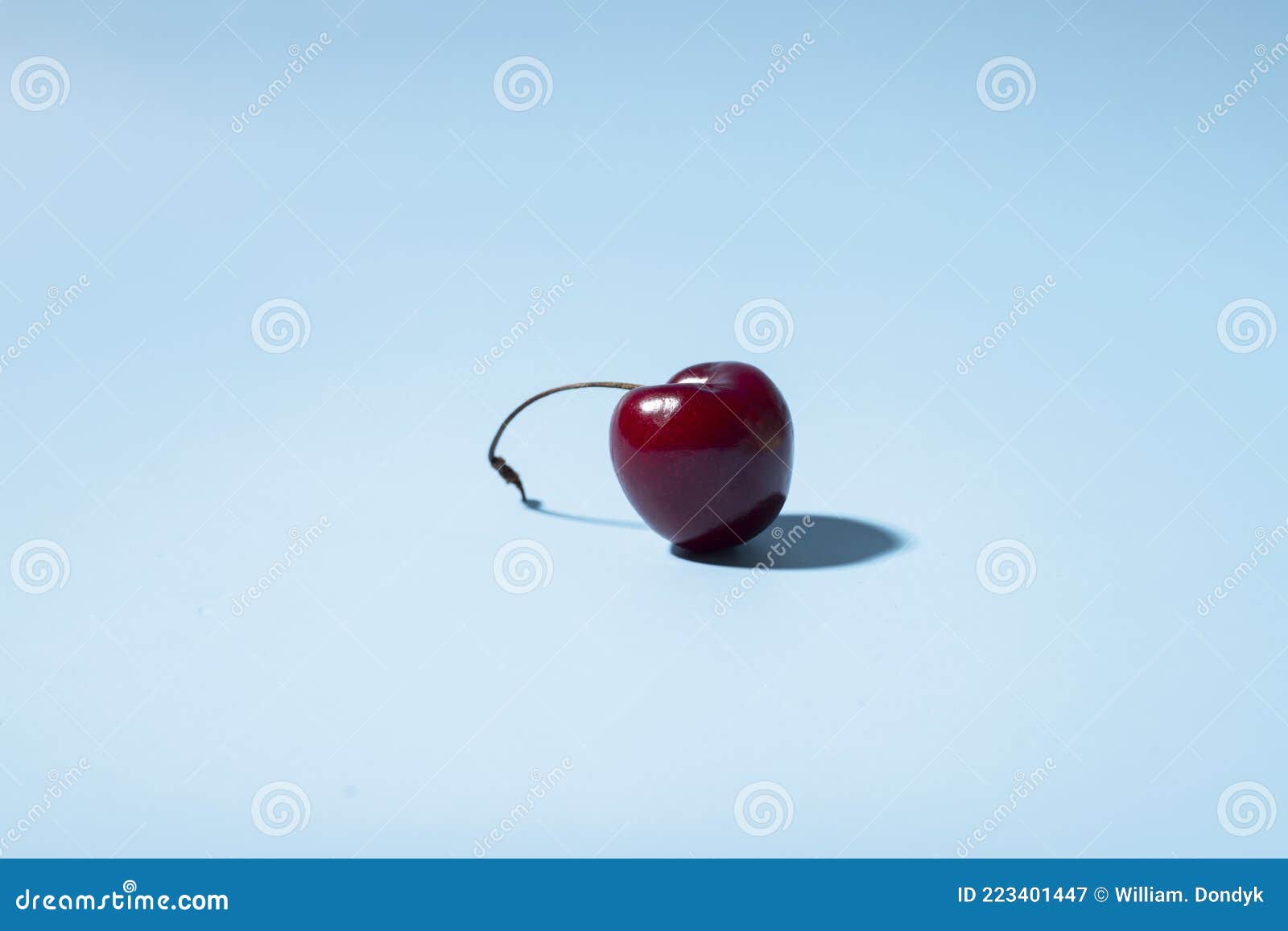 One Cherry on Blue Background Stock Image - Image of light, object ...