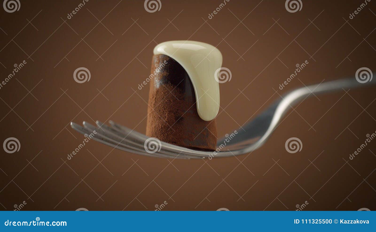One Chocolate Candy on Fork Covered by White Cream, Falling Down Stock ...