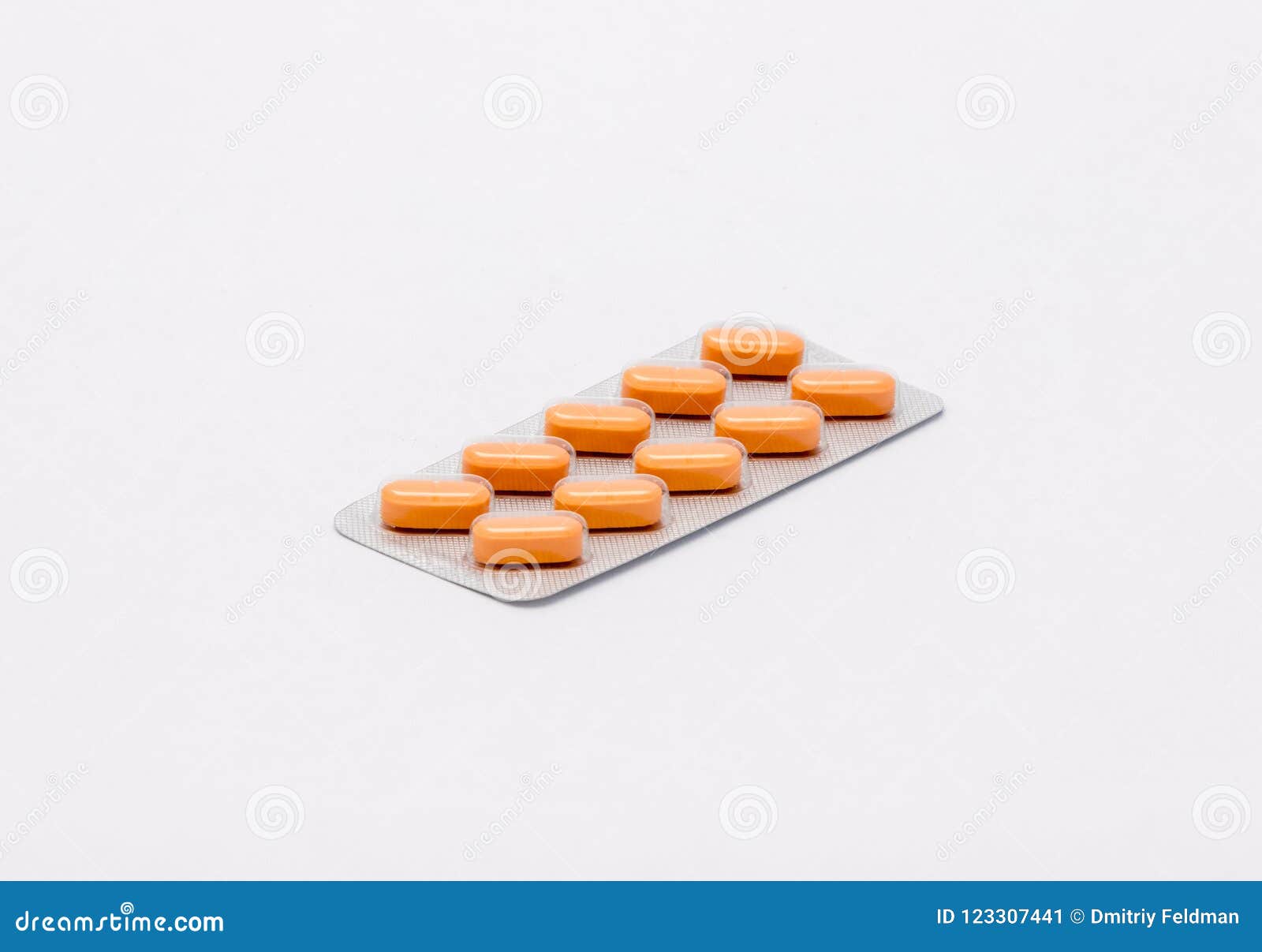 One Complete Sealed Package with Orange Rectangular Pills Lies on a ...