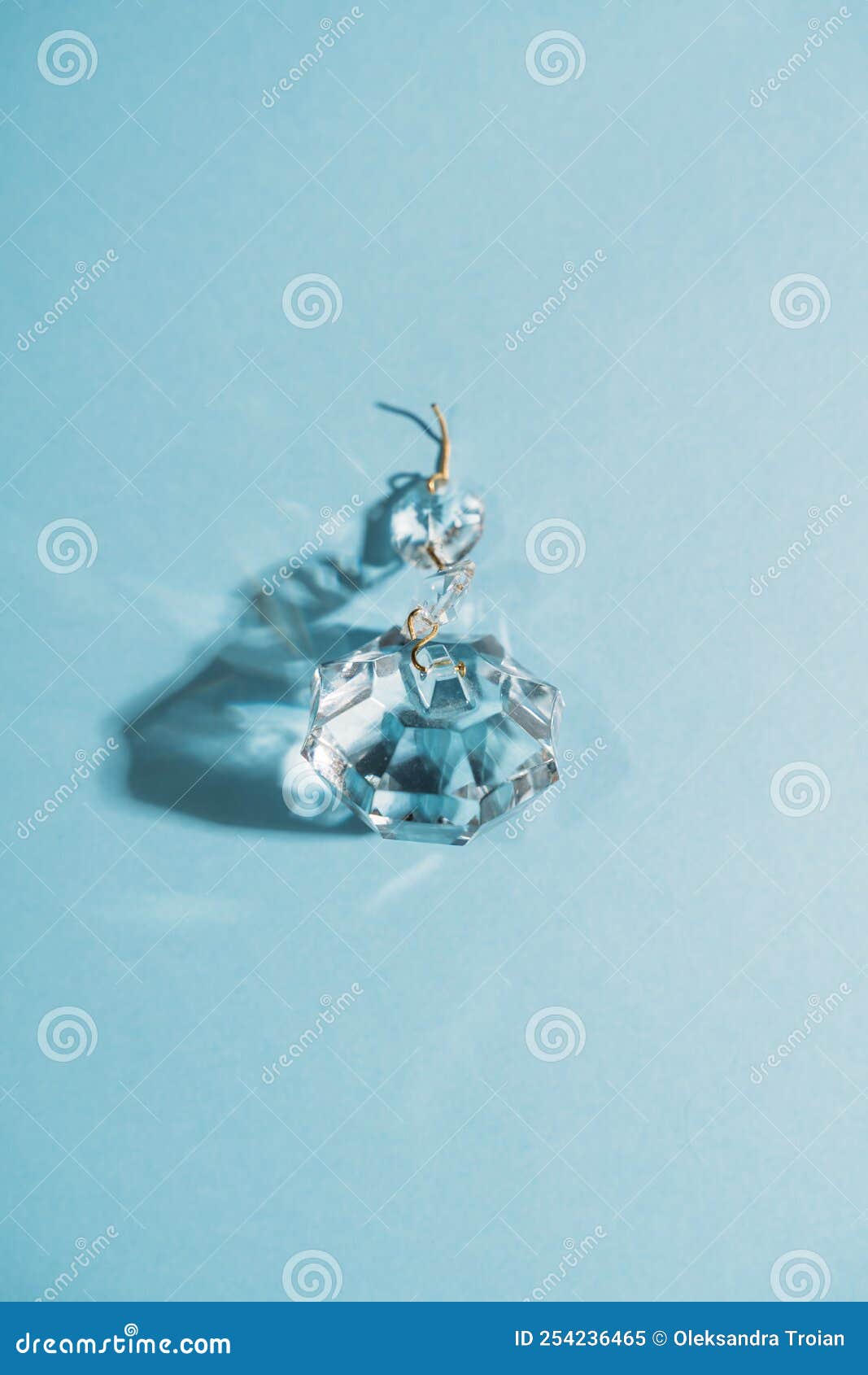 One Crystals with Light Refraction on Blue Minimal Background Stock ...