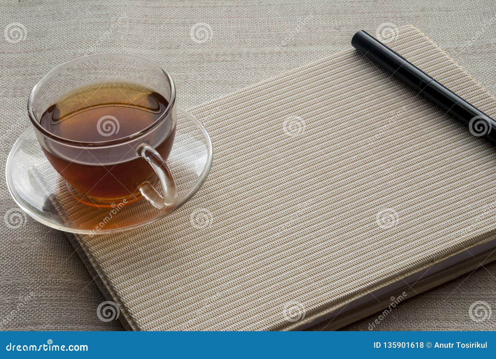 One Cup of Tea is on the Notebook and Pen Stock Photo - Image of ...