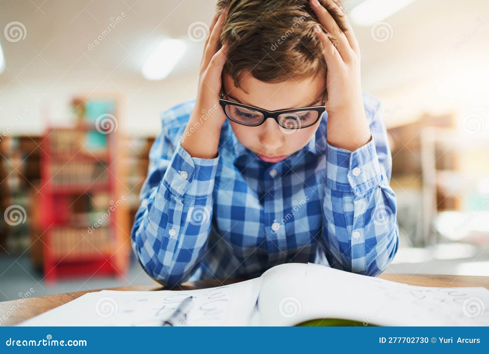 This One is Difficult. a Young Boy Looking Stressed Out while Working ...