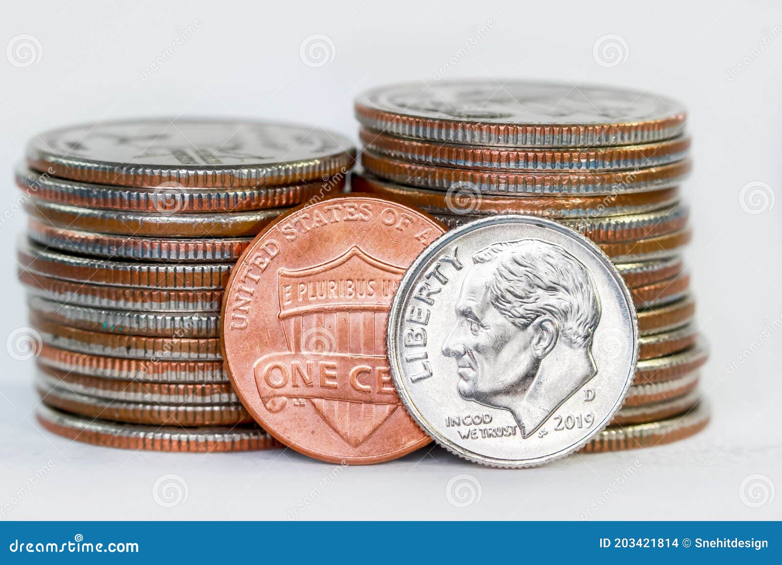 One Dime and Cent Against Stack of American Quarter Coins. Stock Photo ...