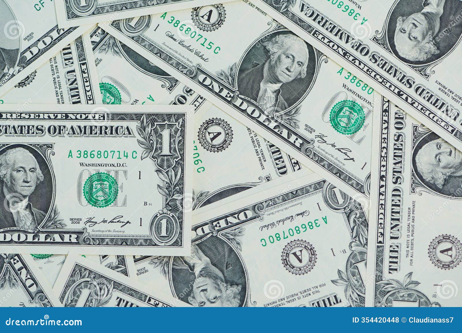 Multiple One Dollar Bills Scattered Across a Surface with a Dollar ...