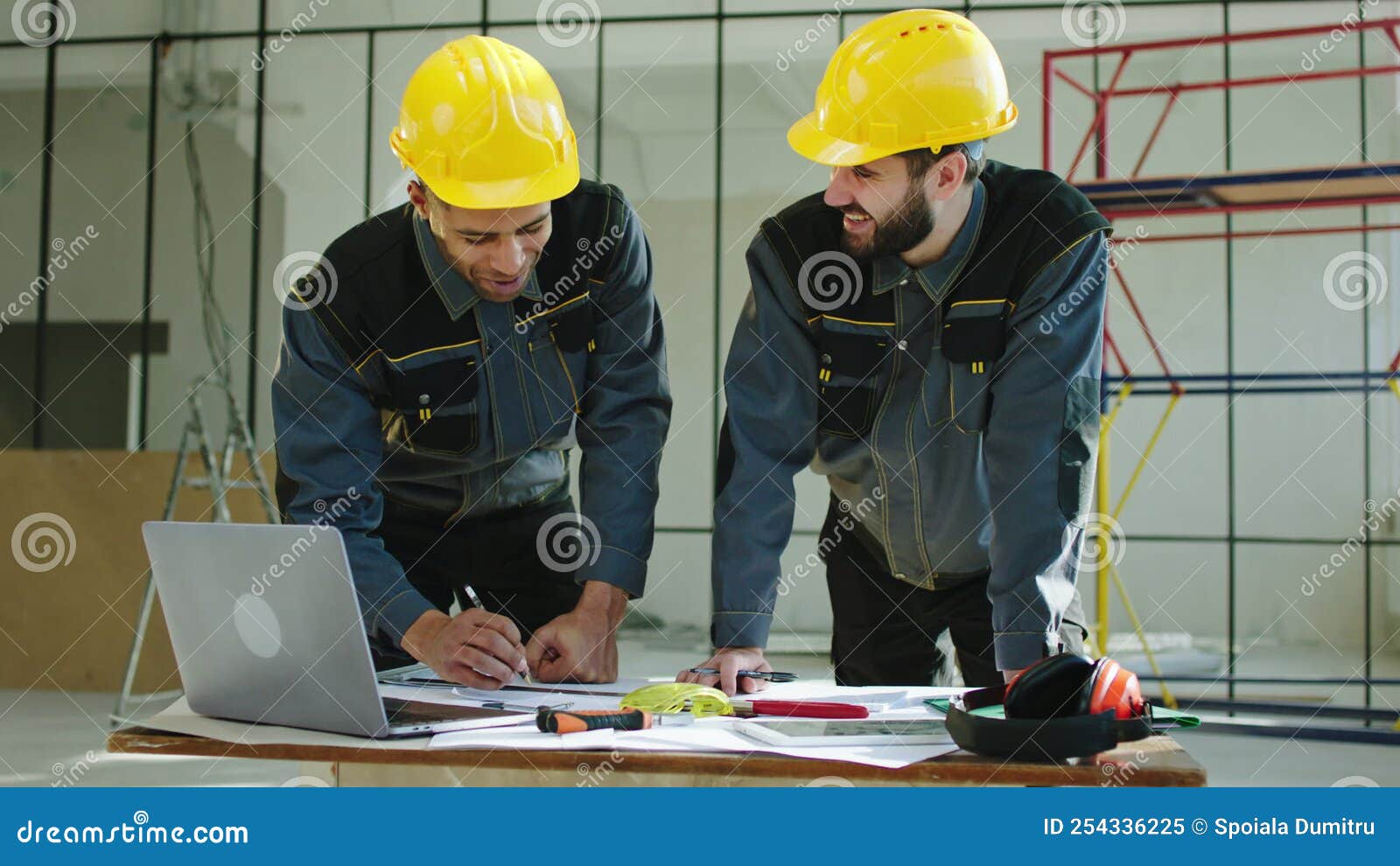 One Engineer and Constructor Man at Construction Site Analysing the ...