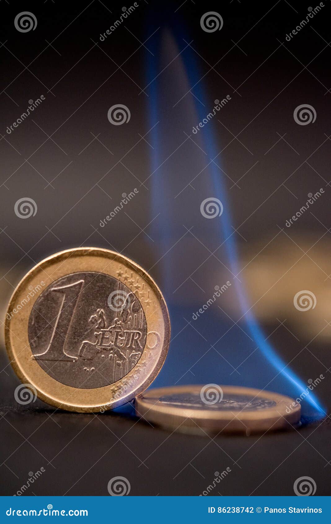 One euro coins on fire stock photo. Image of business - 86238742