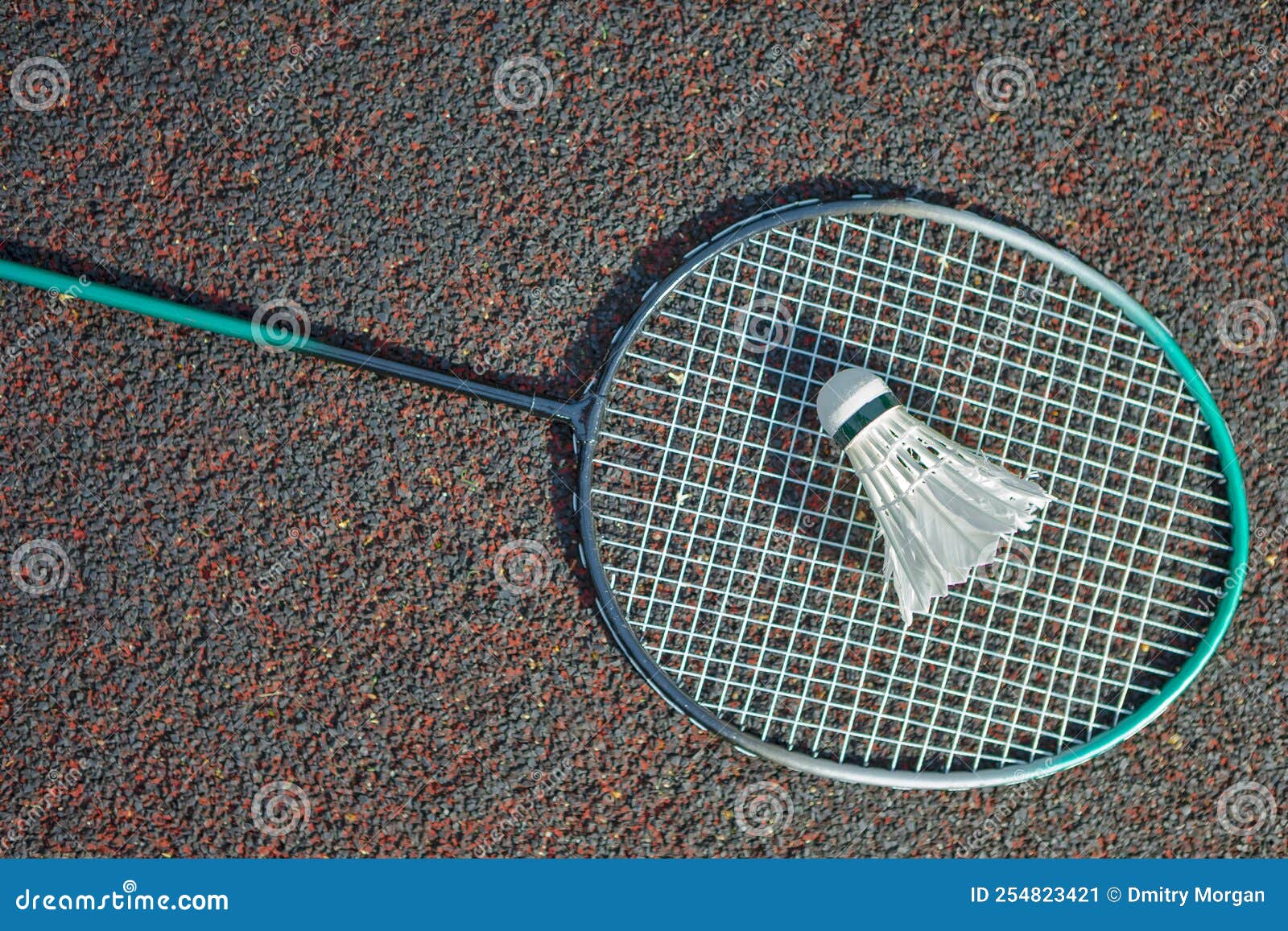 One Feather Shuttlecock on Badminton Racket Placed on Asphalt Surface ...