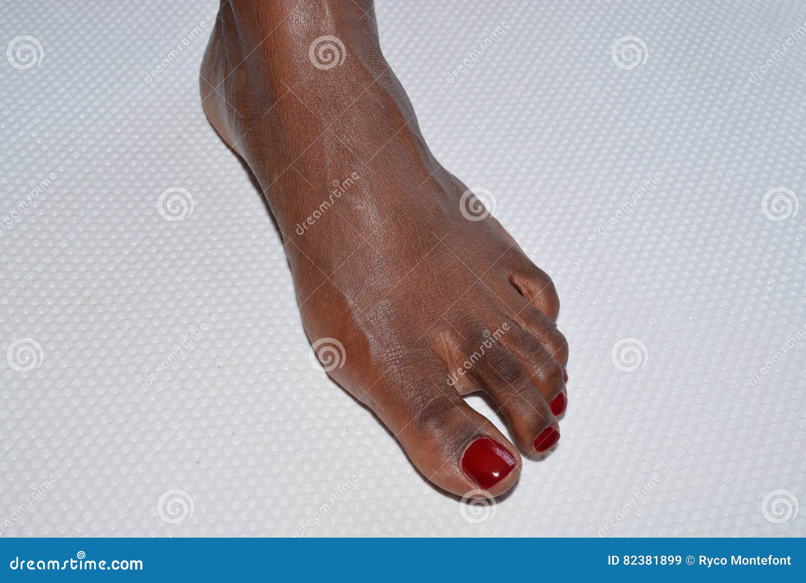 One Female Foot Facing the Side in a White Background Stock Image ...
