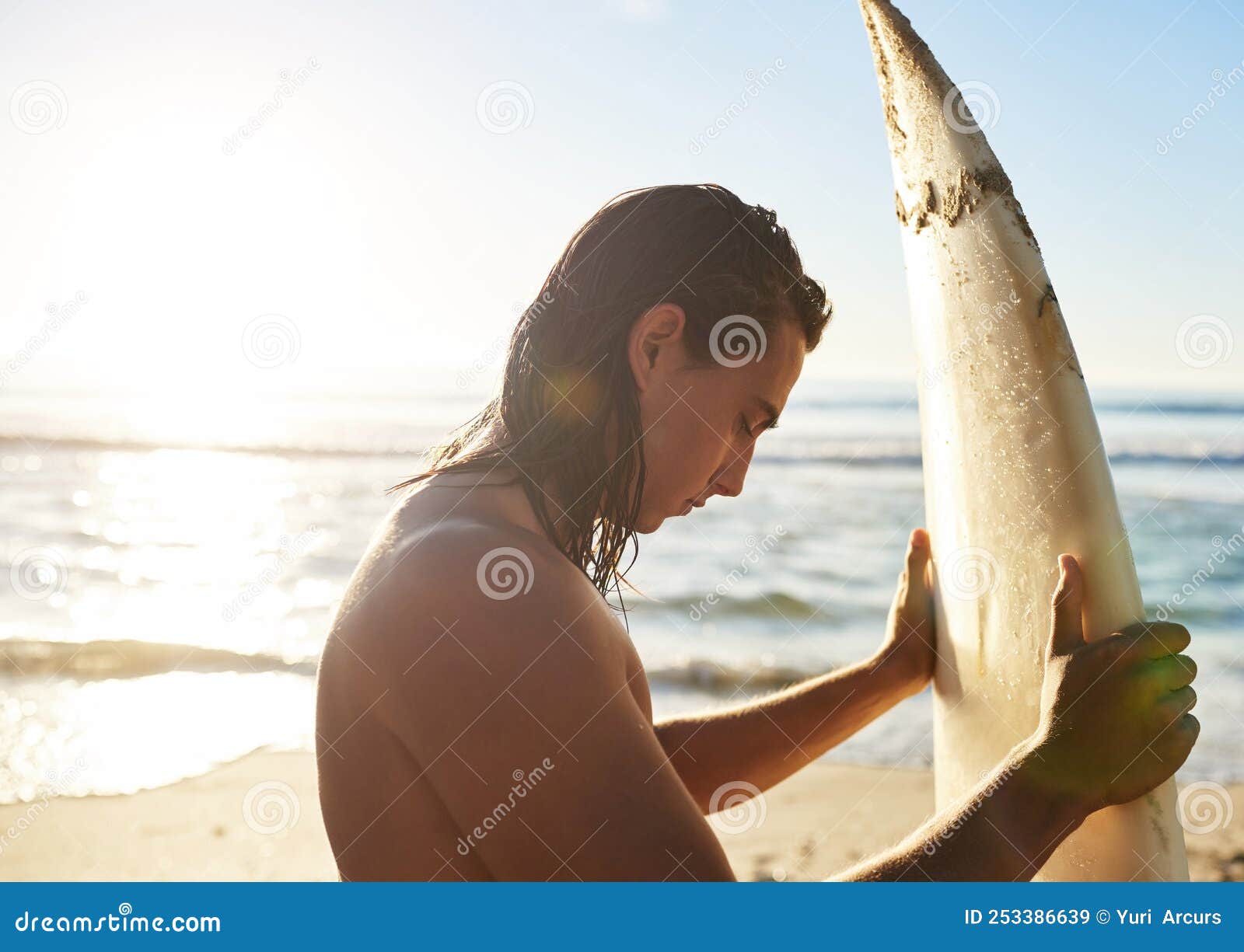 One Final Check before Chasing Waves. a Handsome Young Man Holding and ...
