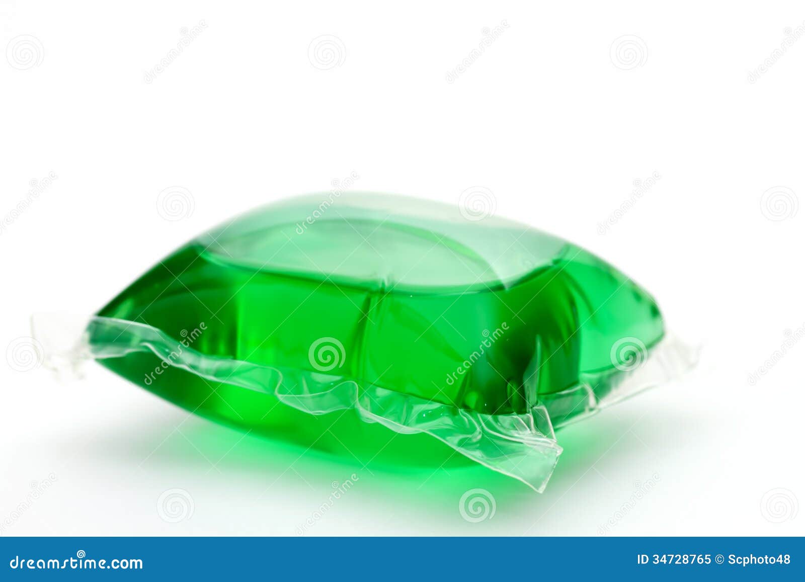 One Green Laundry Detergent Capsule Stock Image - Image of environment ...