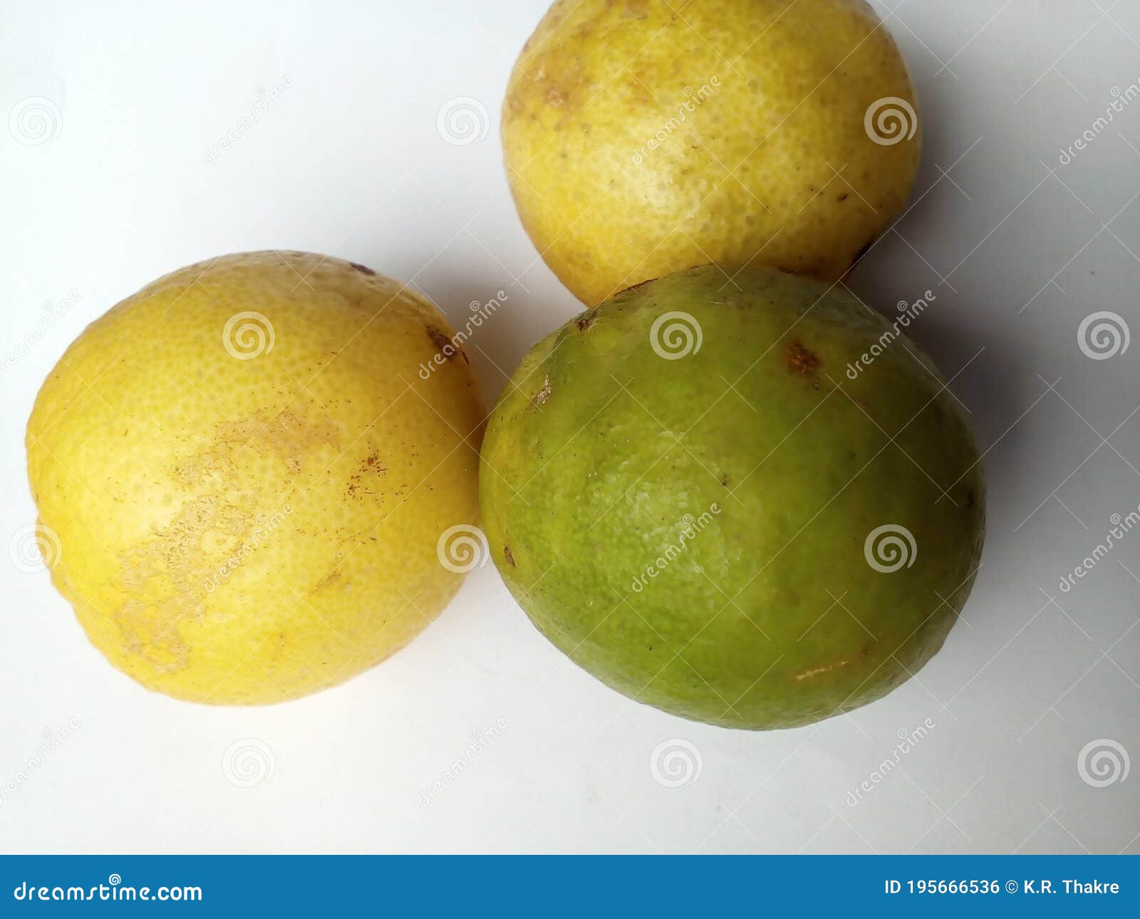 One Green and Two Yellow Lemons with White Background Stock Photo ...