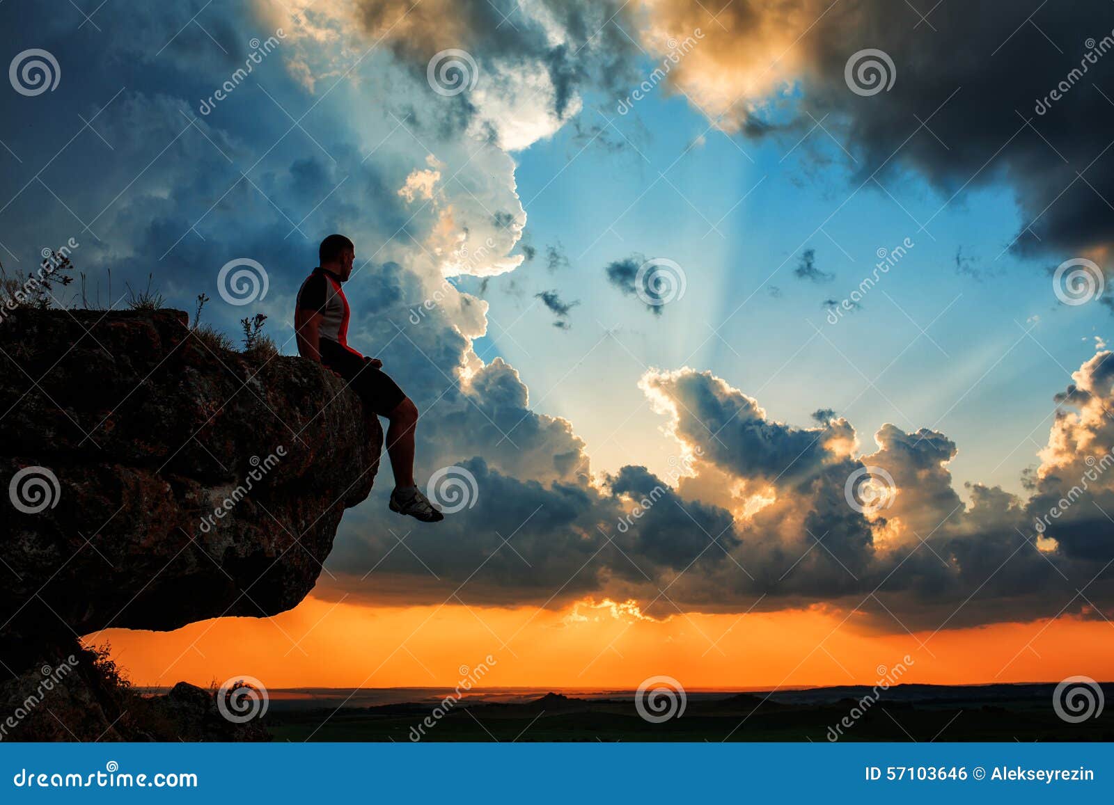 One guy sits on a rock stock photo. Image of relaxation - 57103646