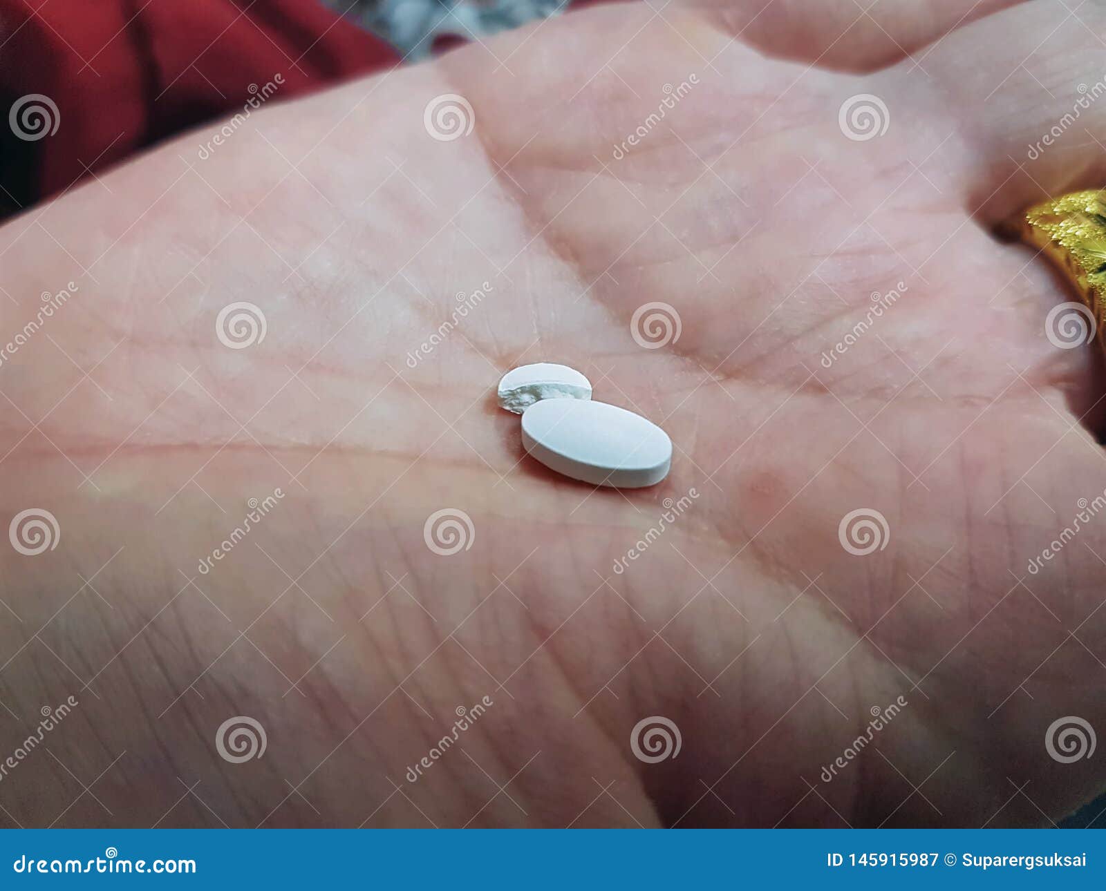 One and a Half White Medication Pills in a Palm of Hand Stock Image ...