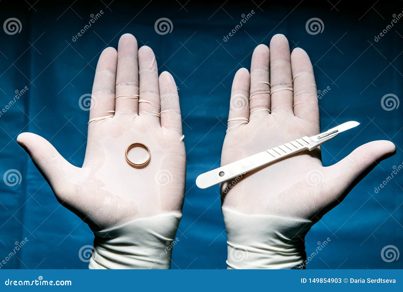 In One Hand The Doctor Holds A Wedding Ring And In The Other A