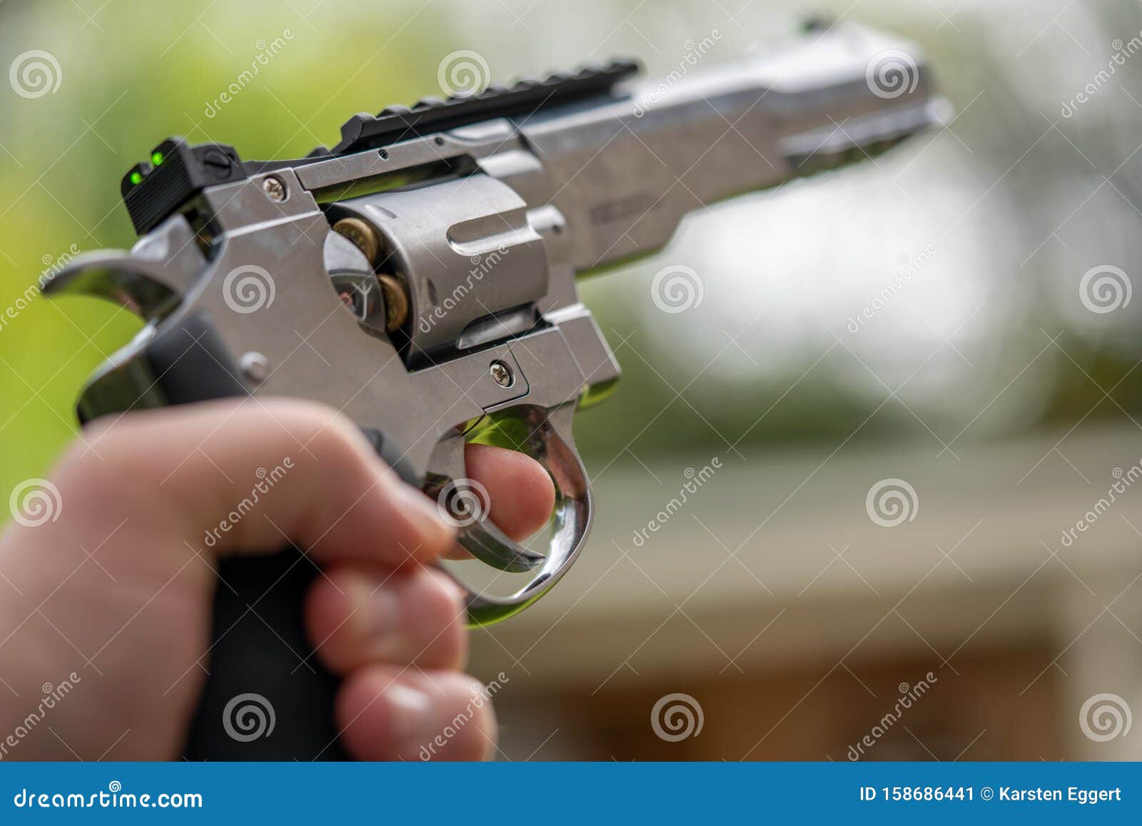 One Hand is Large Silver Heavy Revolver and Aims into the Air Stock ...