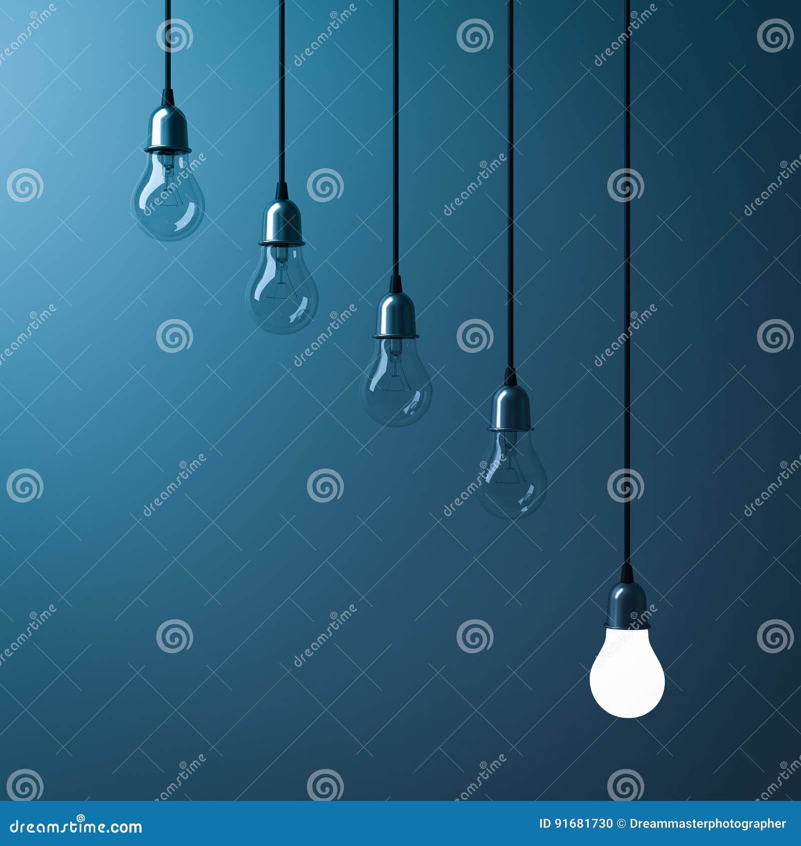 One Hanging Light Bulb Glowing Different and Standing Out from Unlit ... One Hanging Light Bulb Glowing Different and Standing Out from Unlit ...